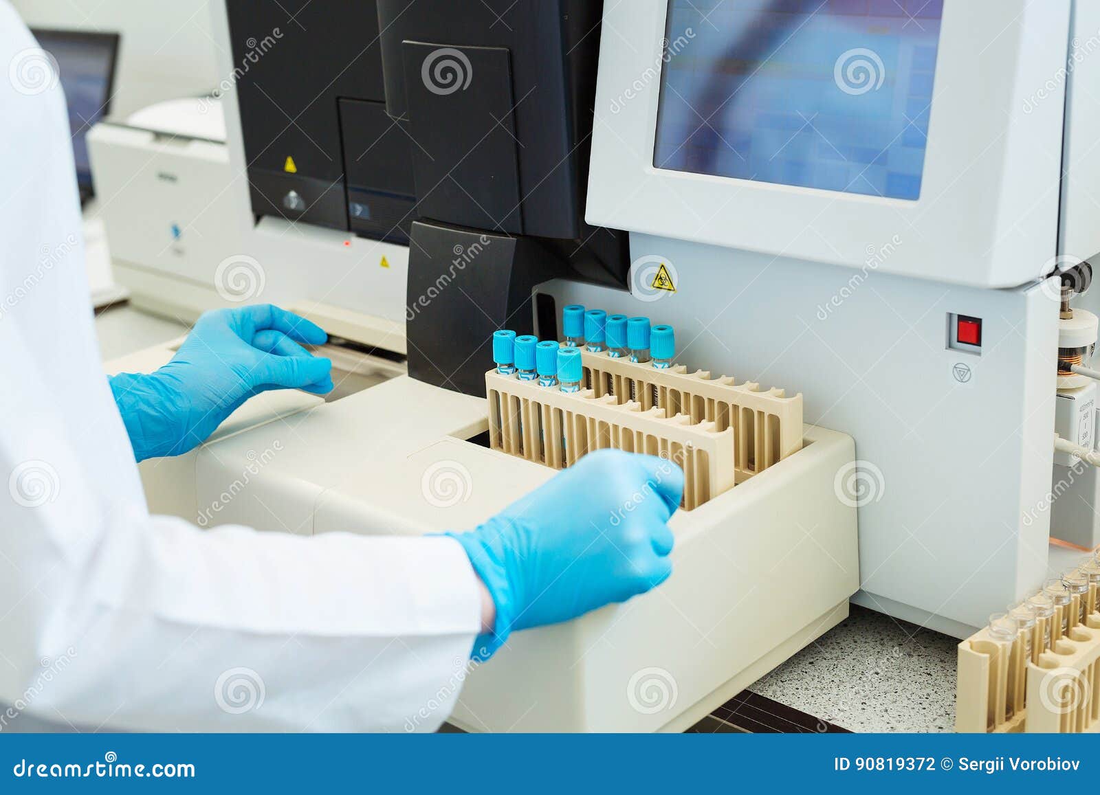 Hands of Laboratory Assistant Loading Sample Tubes for Coagulation Test ...