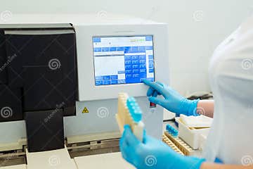 Hands of Laboratory Assistant Loading Sample Tubes for Coagulation Test ...