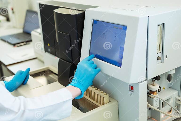 Hands of Laboratory Assistant Loading Sample Tubes for Coagulation Test ...