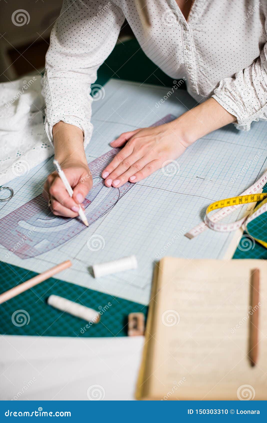 Hands of Lady Tailor Working in Her Studio, Tools and Fabric Samples on ...