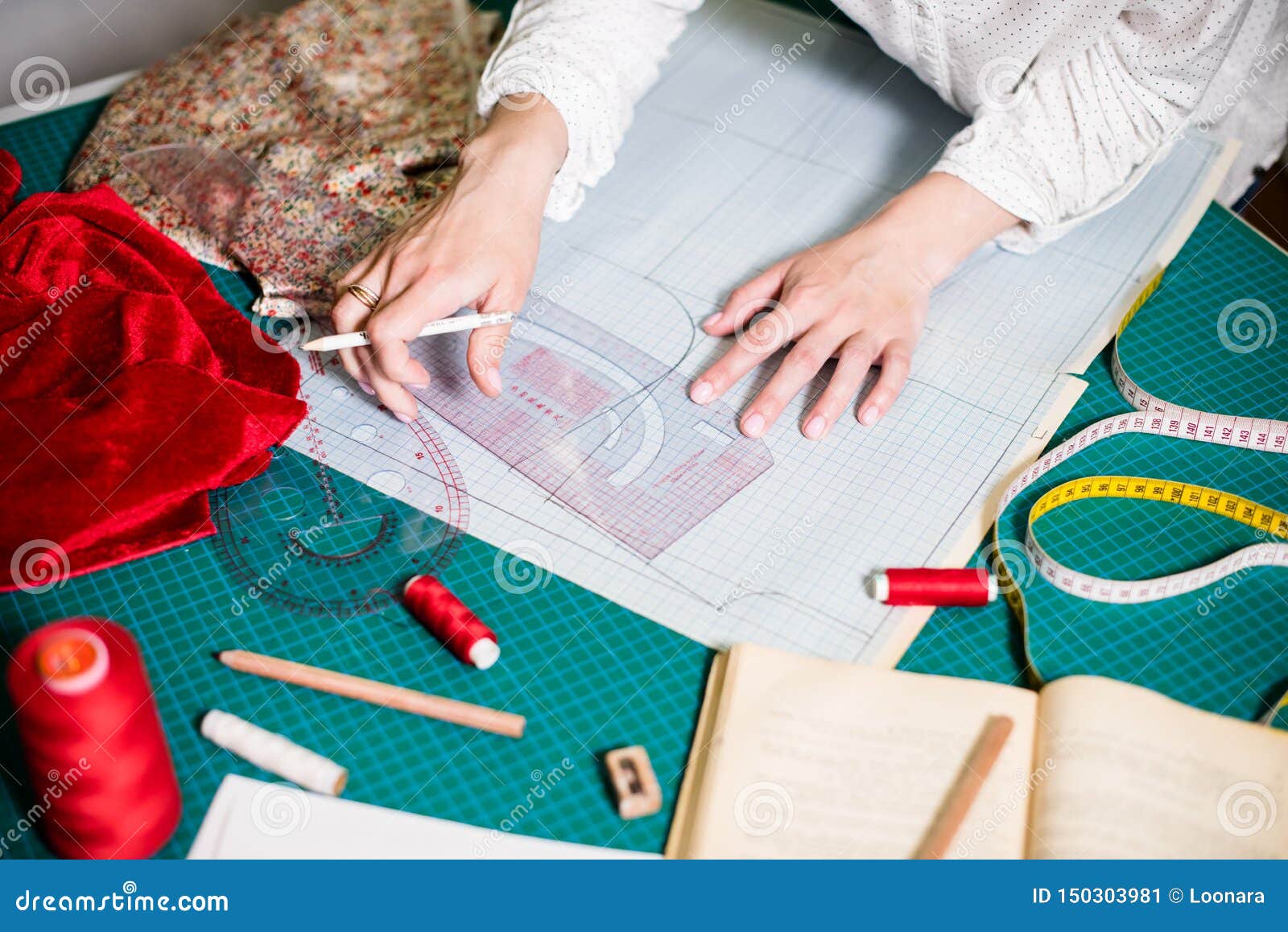 Hands of Lady Tailor Working in Her Studio, Tools and Fabric Samples on ...