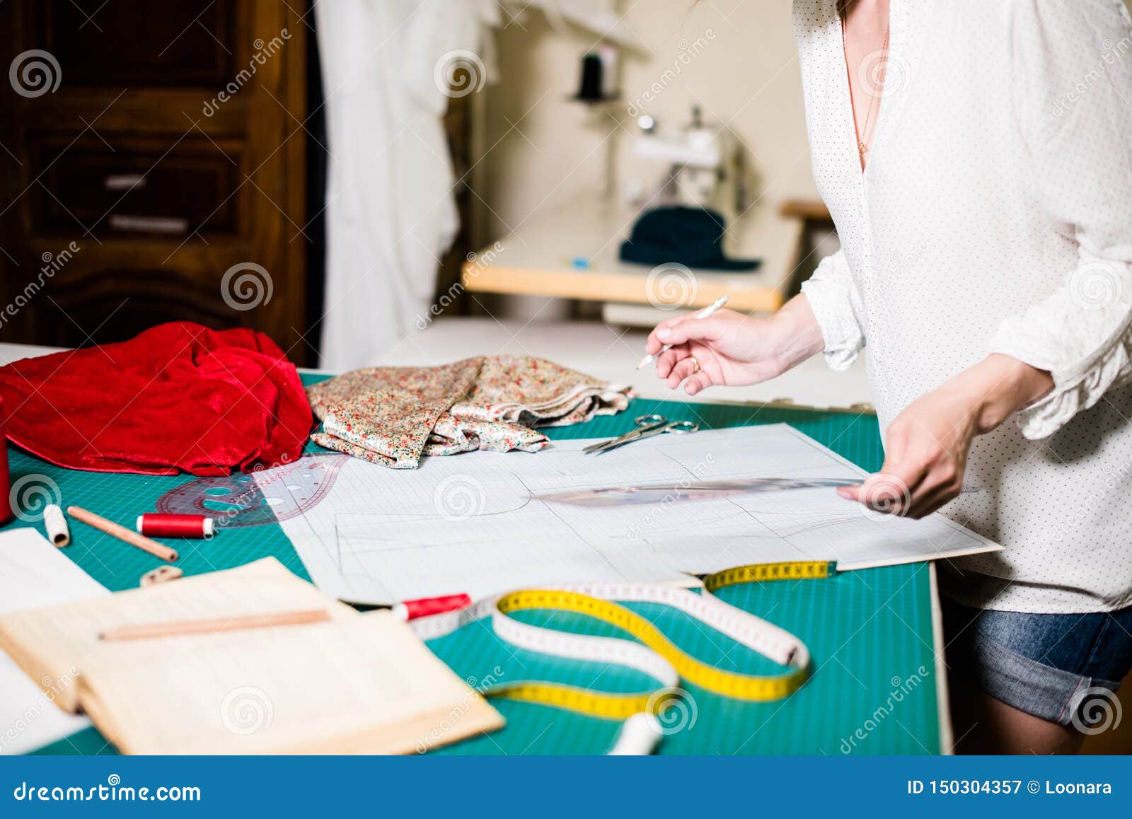 Hands of Lady Tailor Working in Her Studio, Tools and Fabric Samples on ...