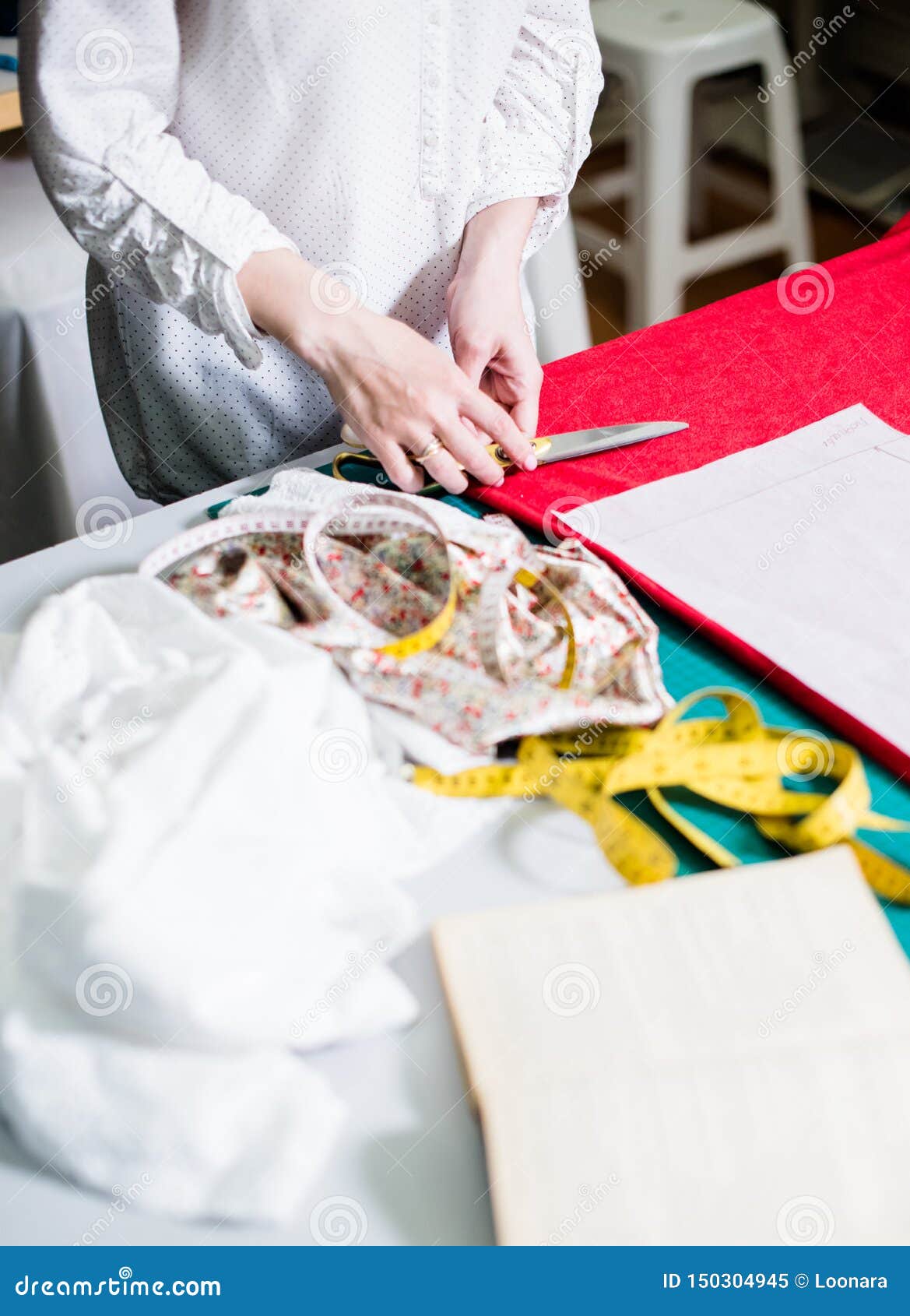 Hands of Lady Tailor Working in Her Studio, Tools and Fabric Samples on ...