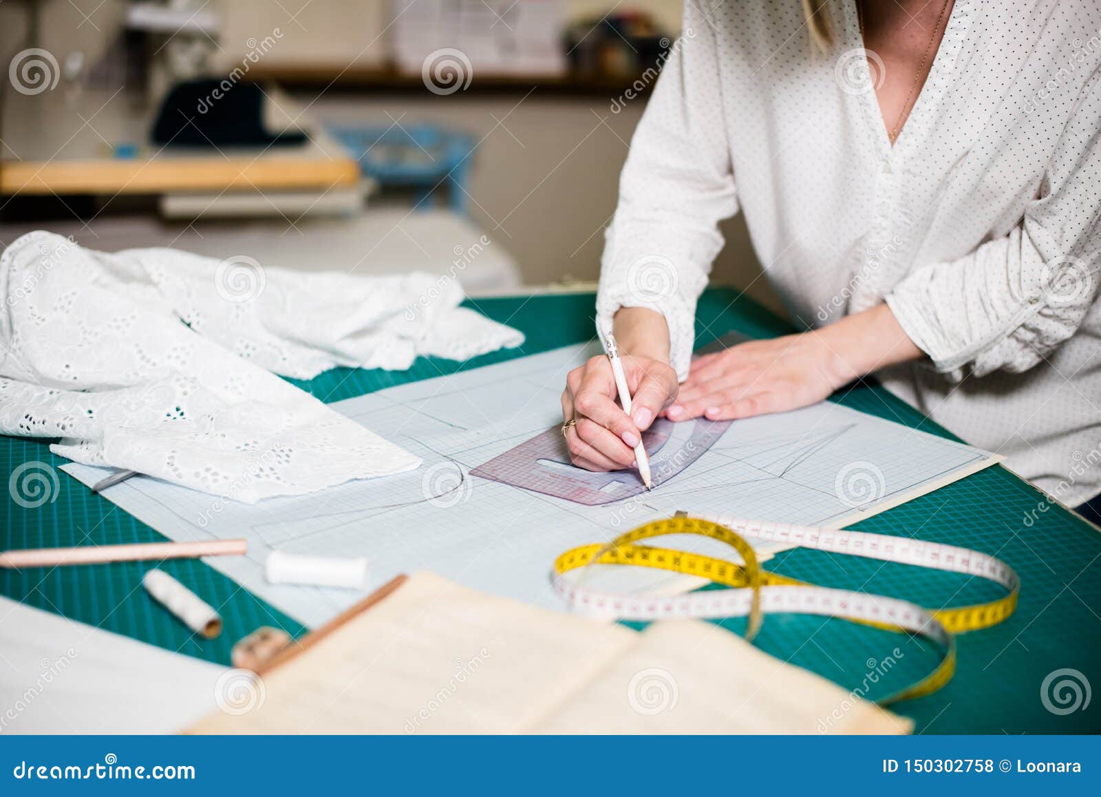 Hands of Lady Tailor Working in Her Studio, Tools and Fabric Samples on ...