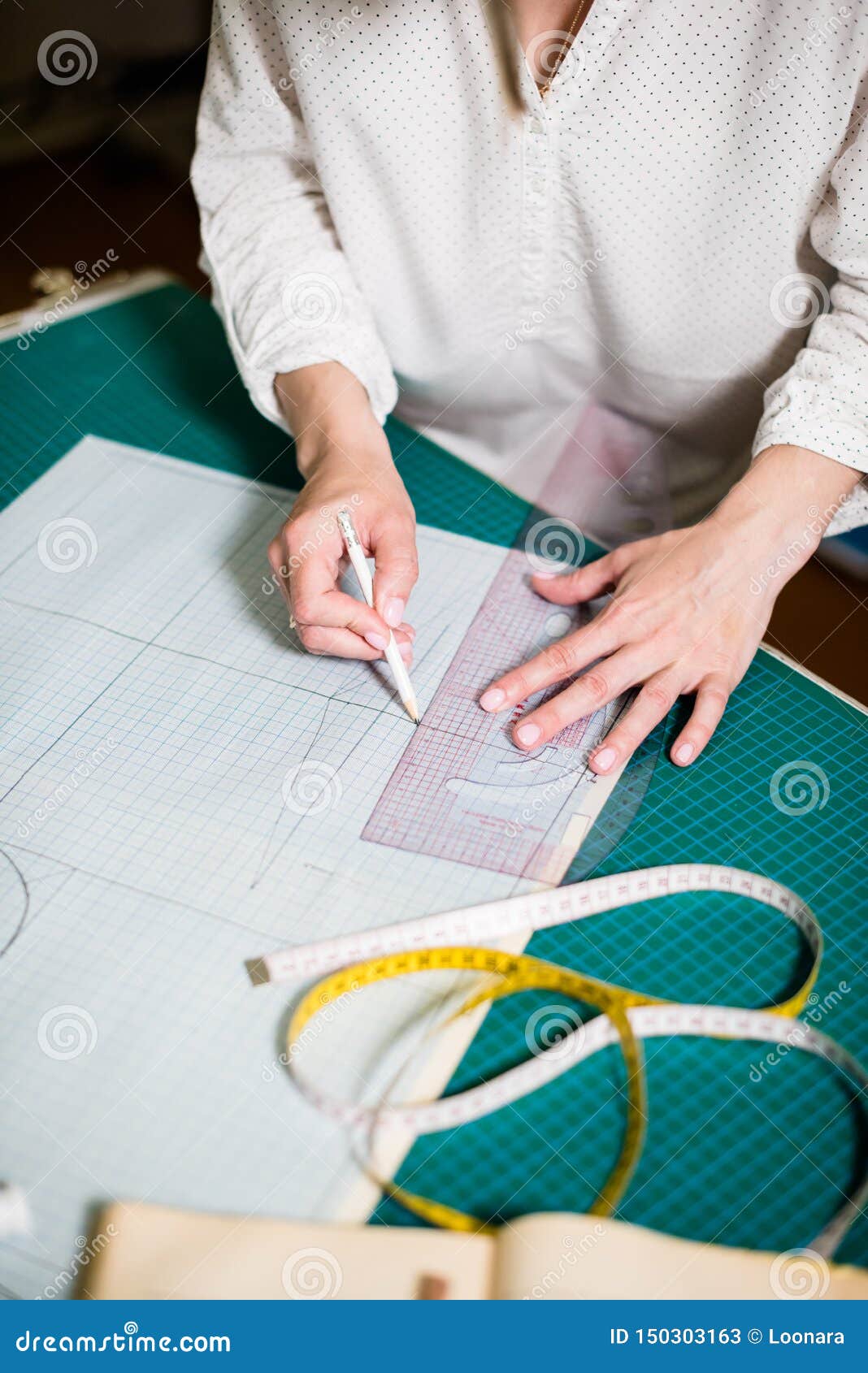 Hands of Lady Tailor Working in Her Studio, Tools and Fabric Samples on ...