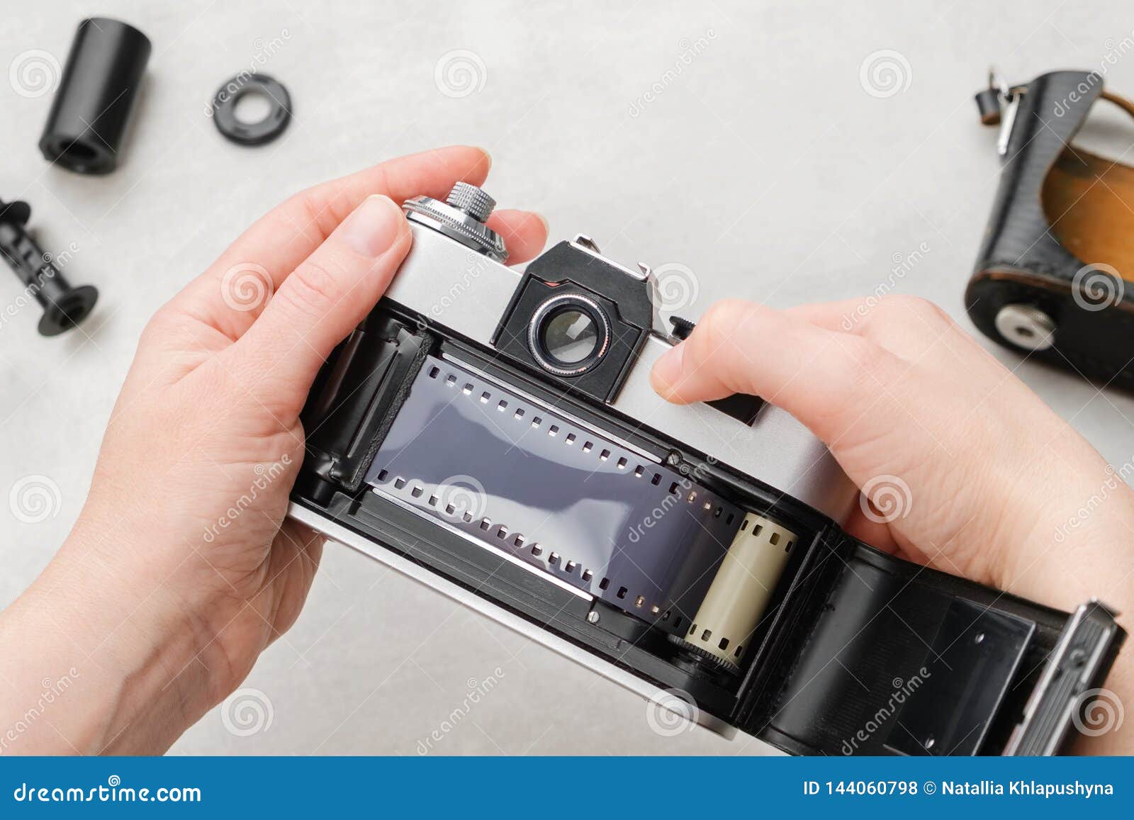 Hands Loading Film into Retro Camera. Stock Photo - Image of retro ...