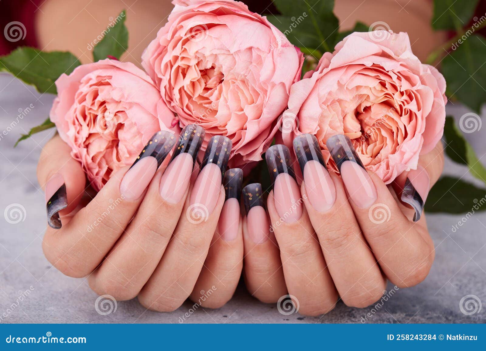 Hands With Long Artificial Manicured Nails Colored With Black Nail