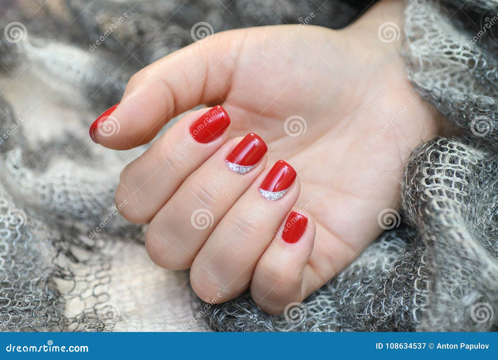 Hands with Long Artificial Manicured Nails Colored with Red Nail Polish ...