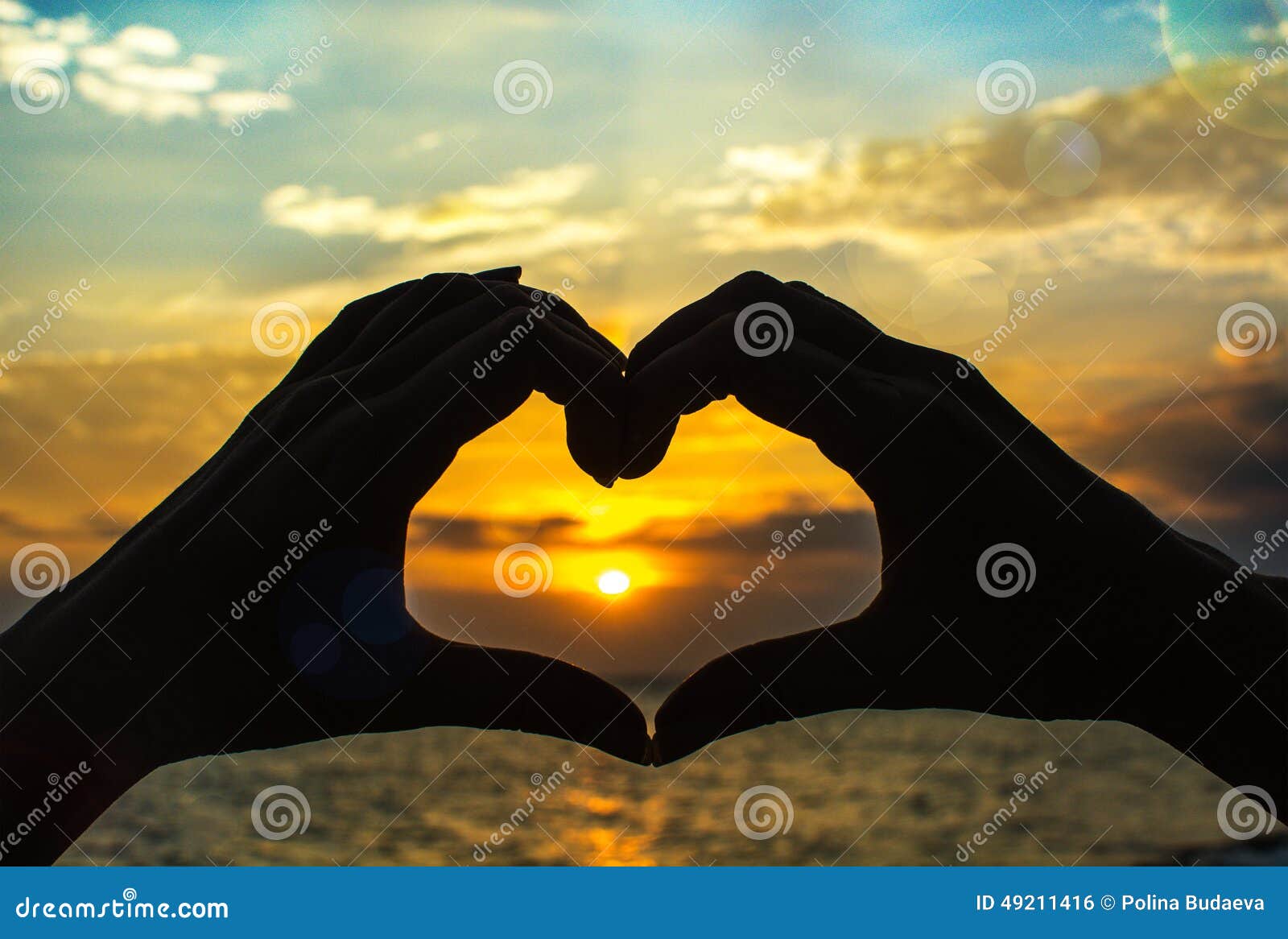 Hands make heart at sunset stock photo. Image of hand - 49211416