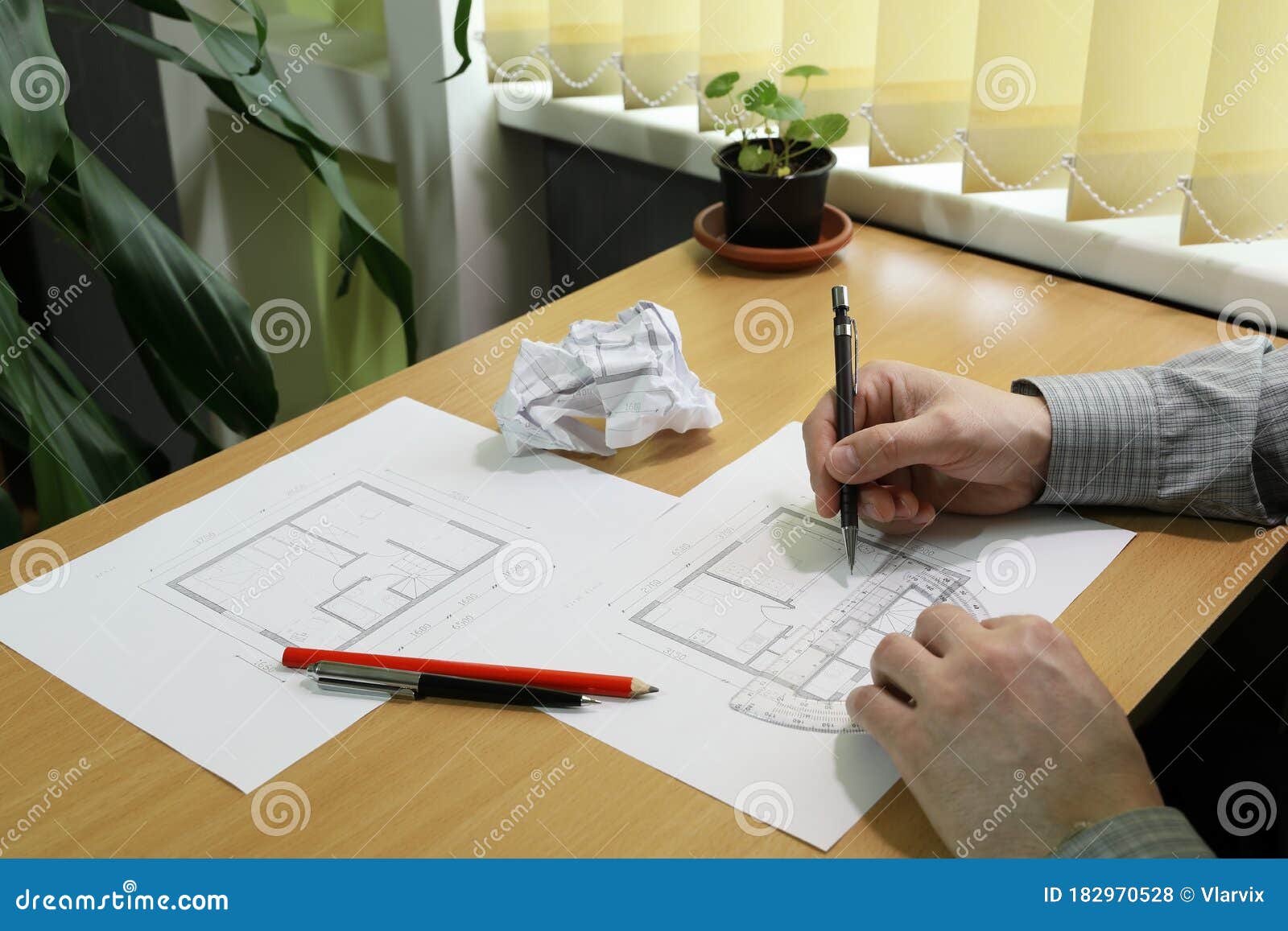 Hands Make Notes and Measurements in an Architectural Floor Plan Stock ...