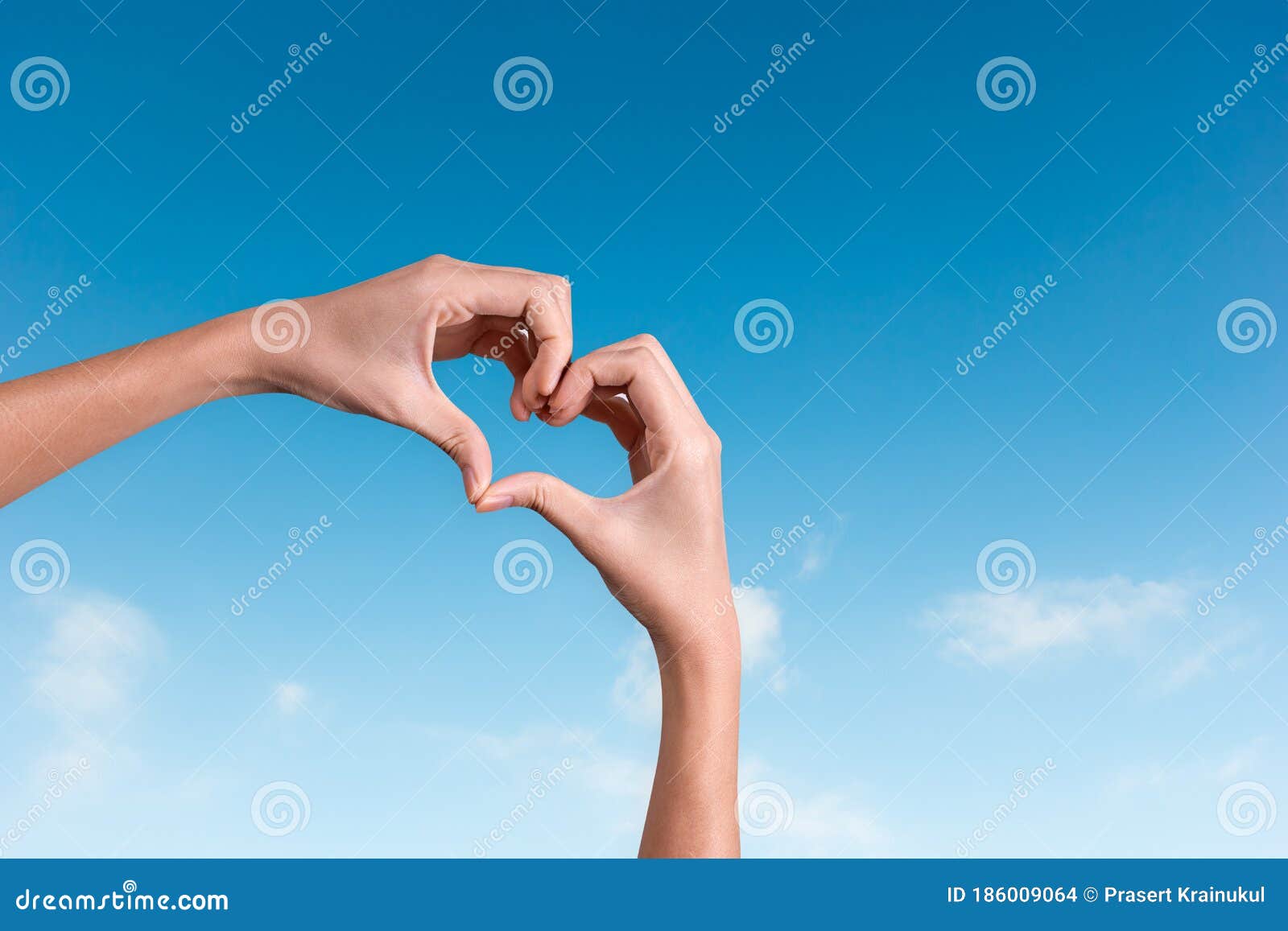 Hands Making a Heart Shape in the Blue Sky Stock Photo - Image of ...