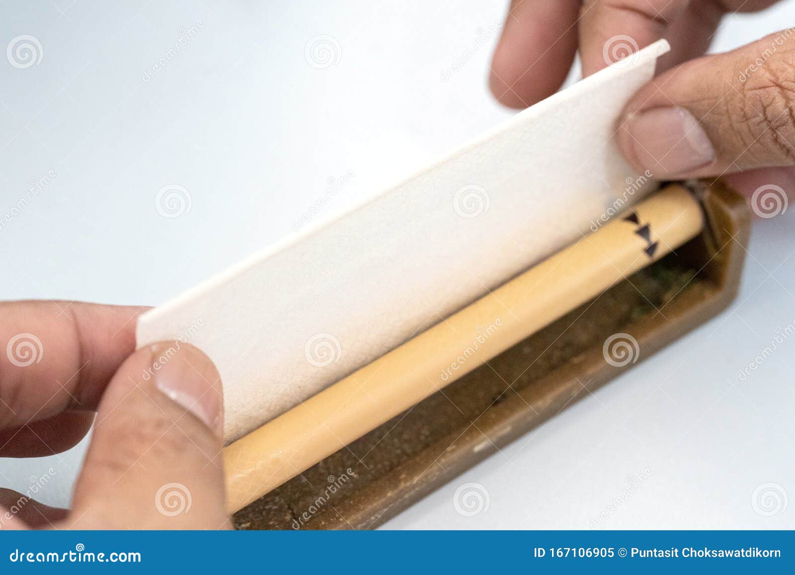 Hands Making Marijuana Joint from Cigarette Rolling Machine, Paper ...