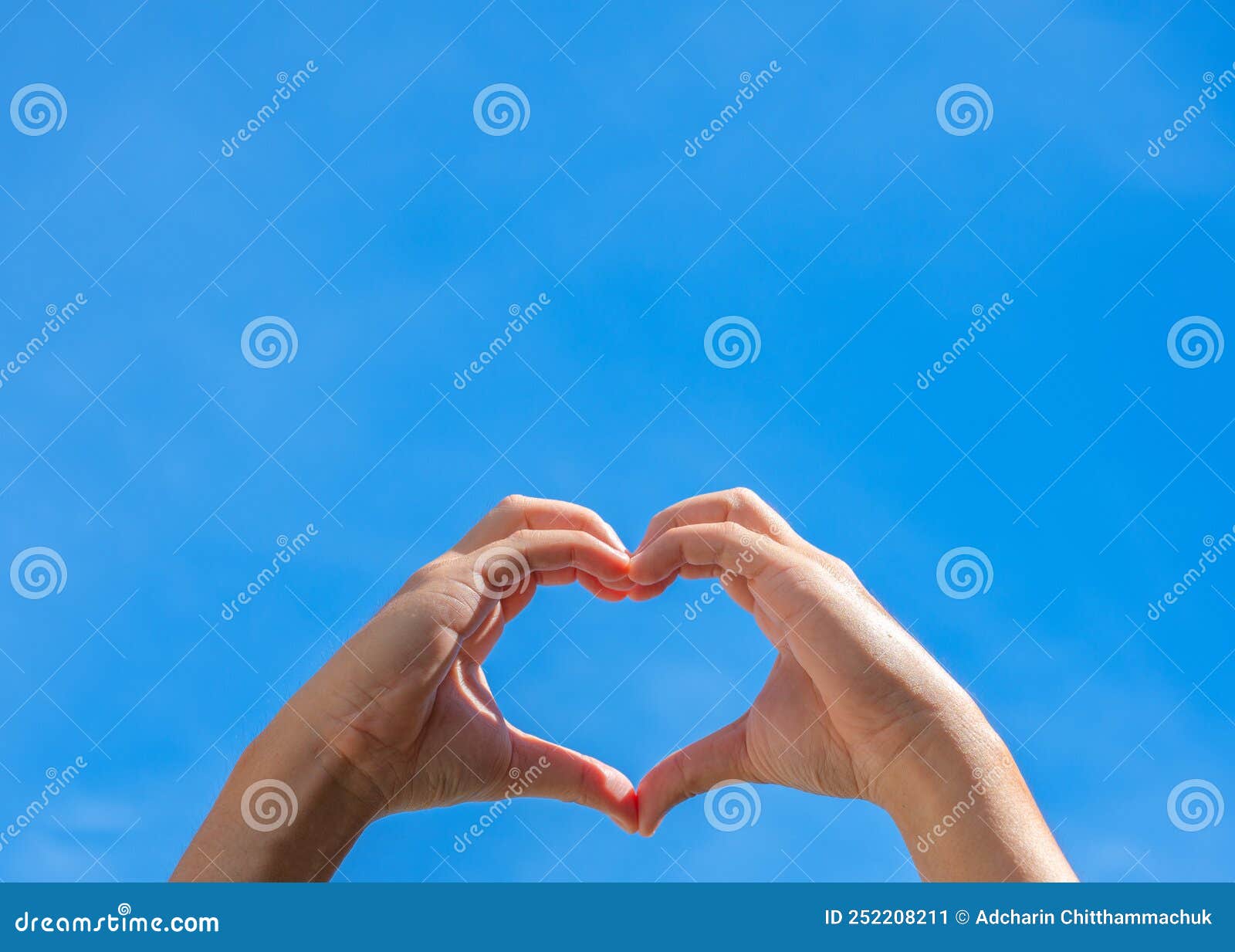 Hands Making Shape of Heart Against the Sky. Love, Friendship Concept ... Hands Making Shape of Heart Against the Sky. Love, Friendship Concept ...
