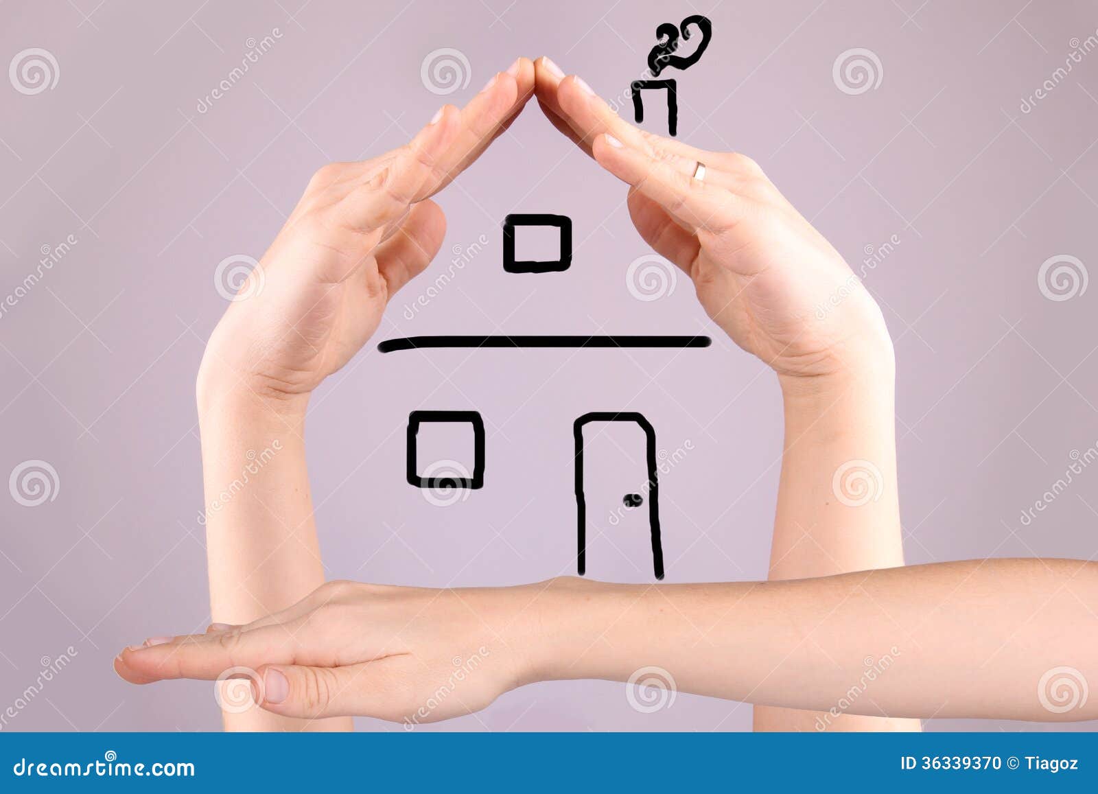 Hands Making the Shape of a House on Gray Background Stock Photo ...