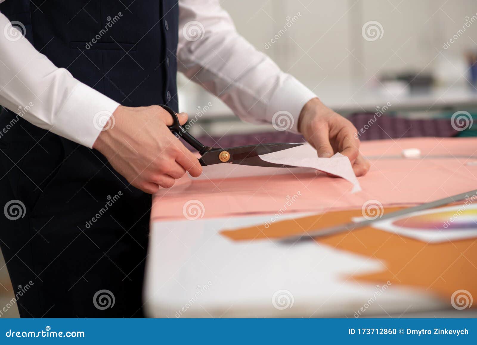 Hands of Male Tailor Cutting Out Paper Pattern Stock Photo - Image of ...