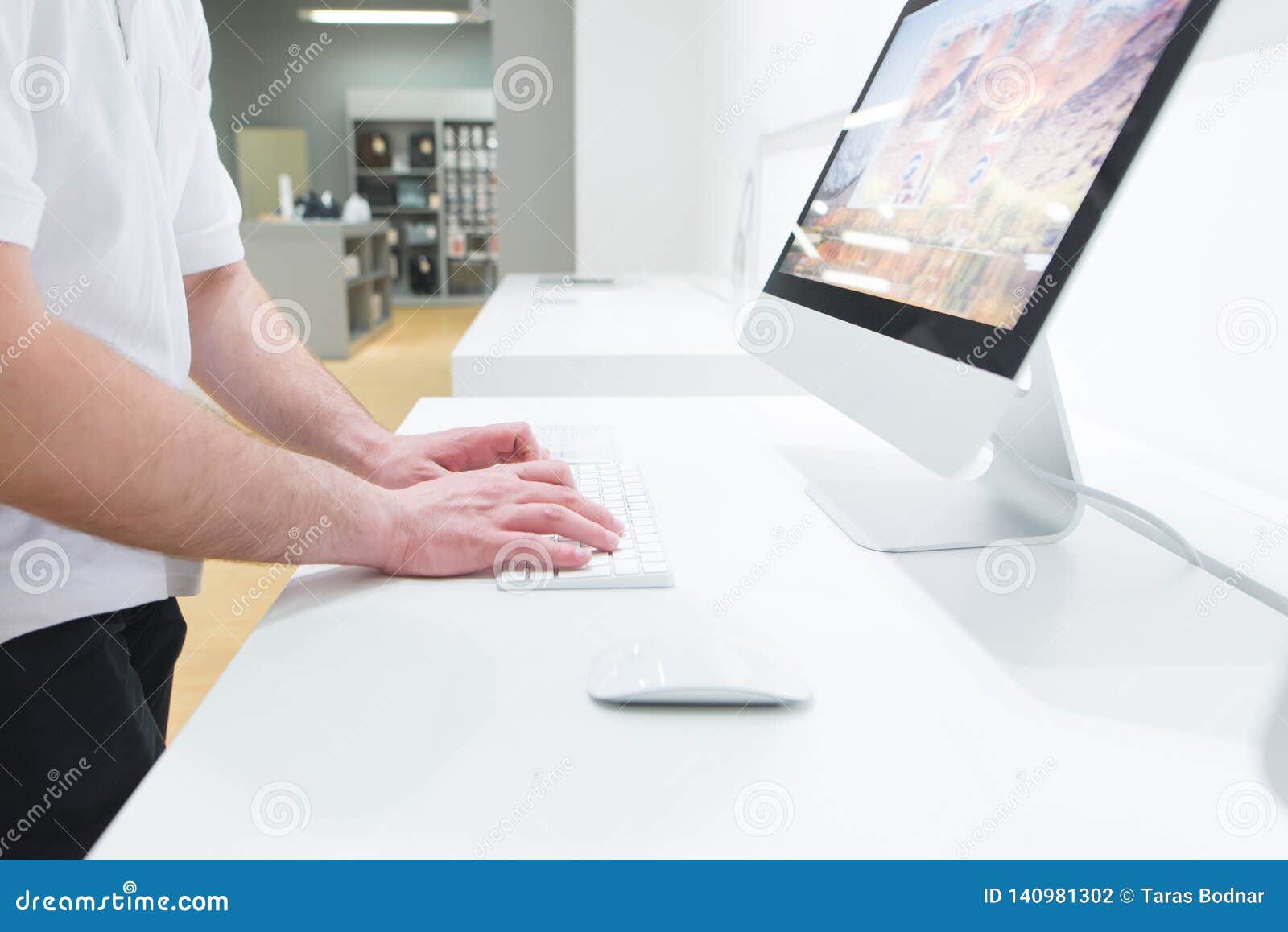 Hands of a Man Close-up on a Mouse and a Computer Keyboard in a ...