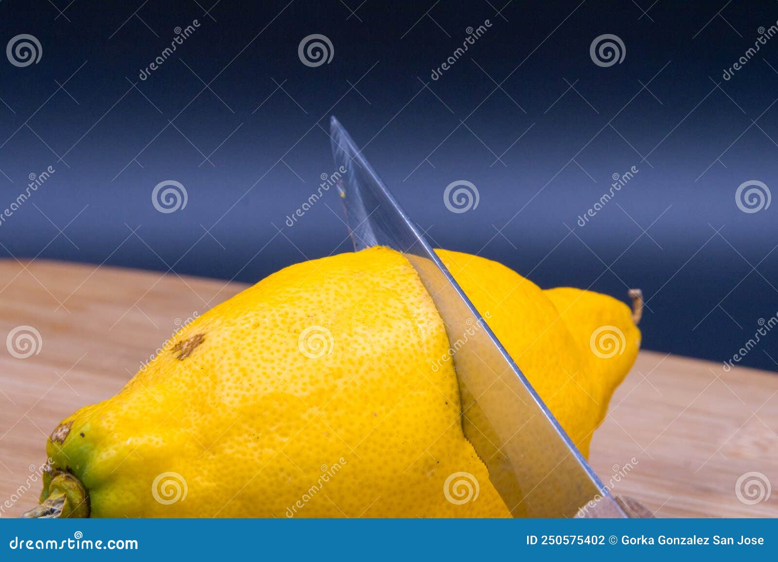 Hands of Man Cutting Lemons on Cutting Board Stock Photo - Image of ...
