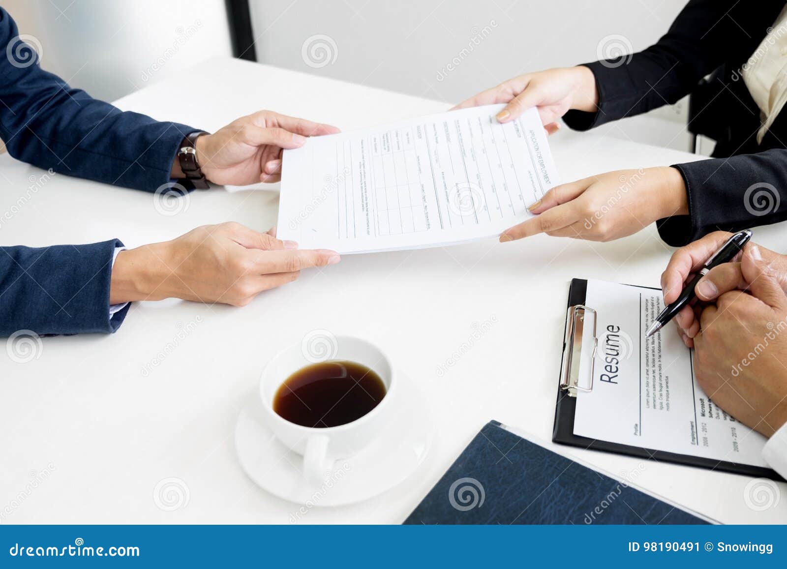 Hands of Man Giving Application Portfolio To HR Man in Office for ...