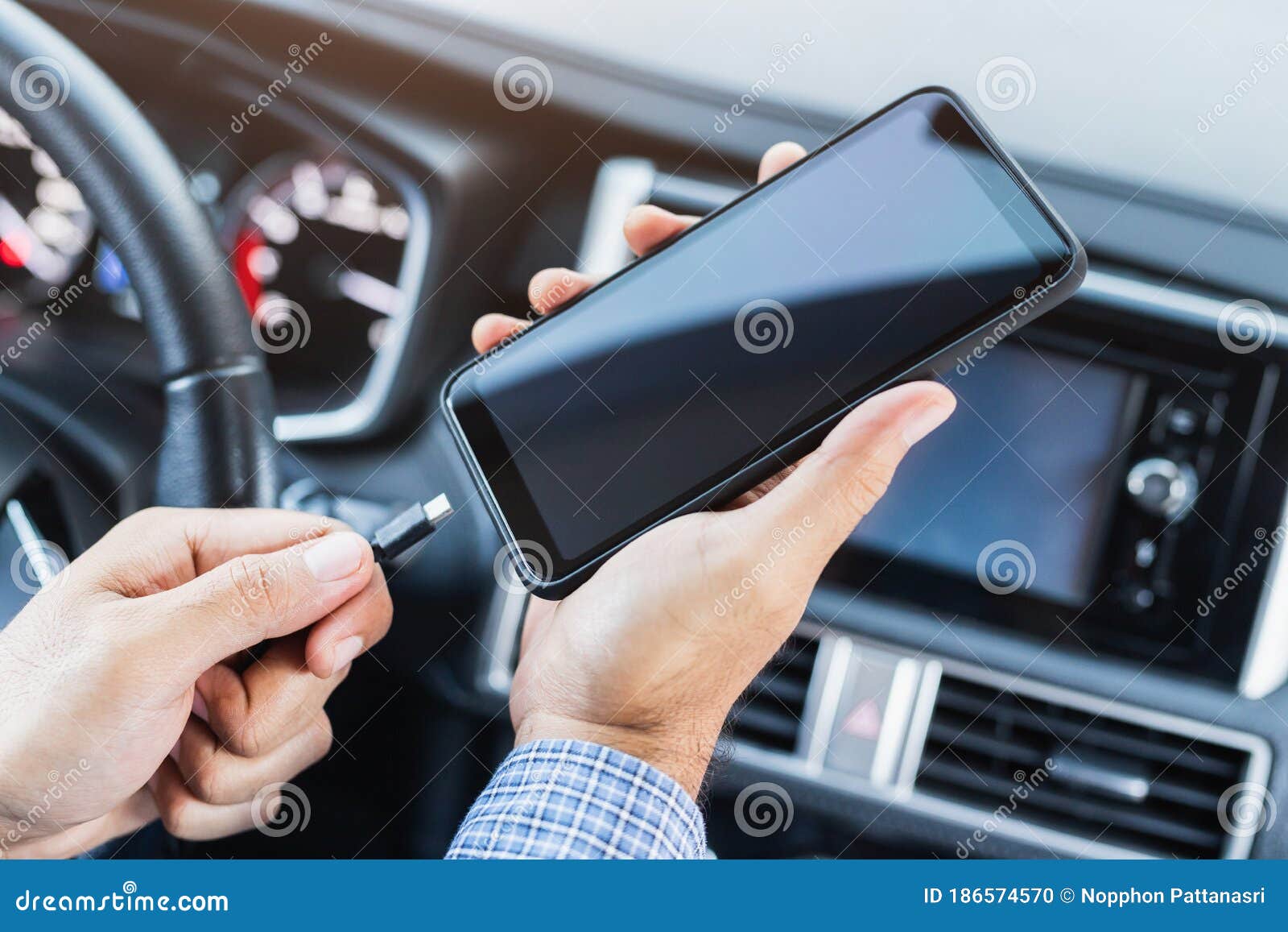Hands Man Holding and Charging Battery Mobile Smartphone in Car with ...