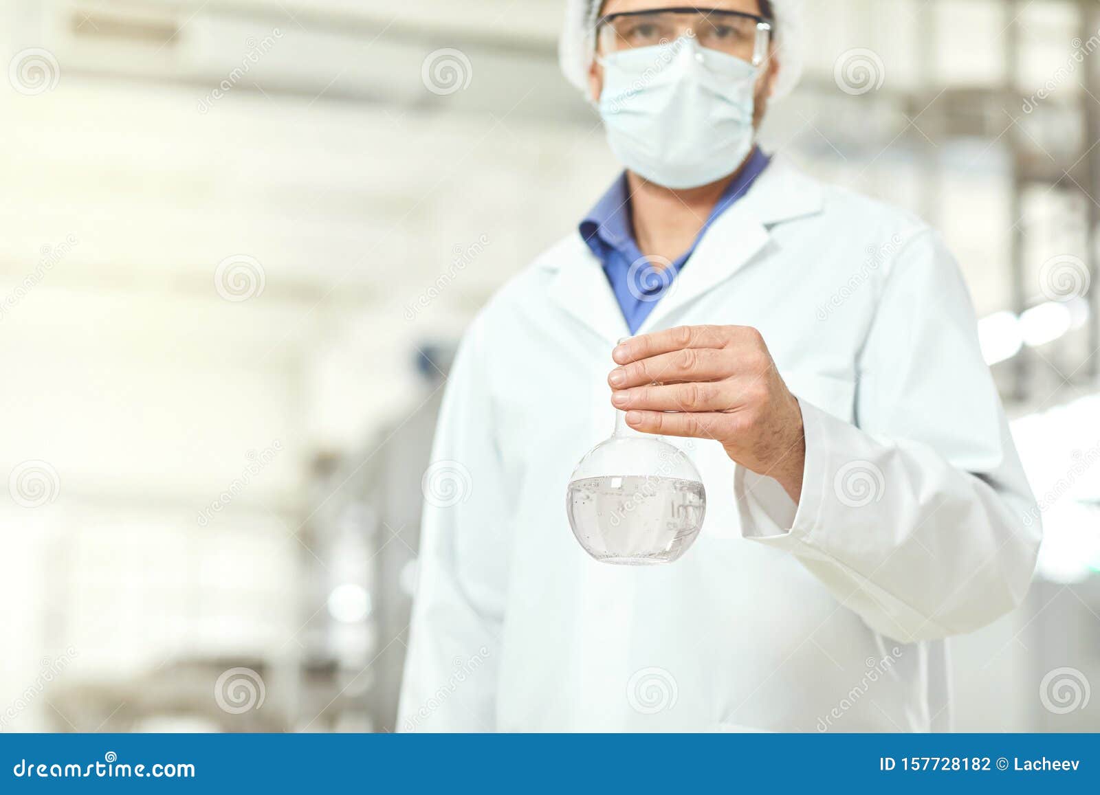 The Hands of a Man Holding a Flask with Test Water Stock Photo - Image ...