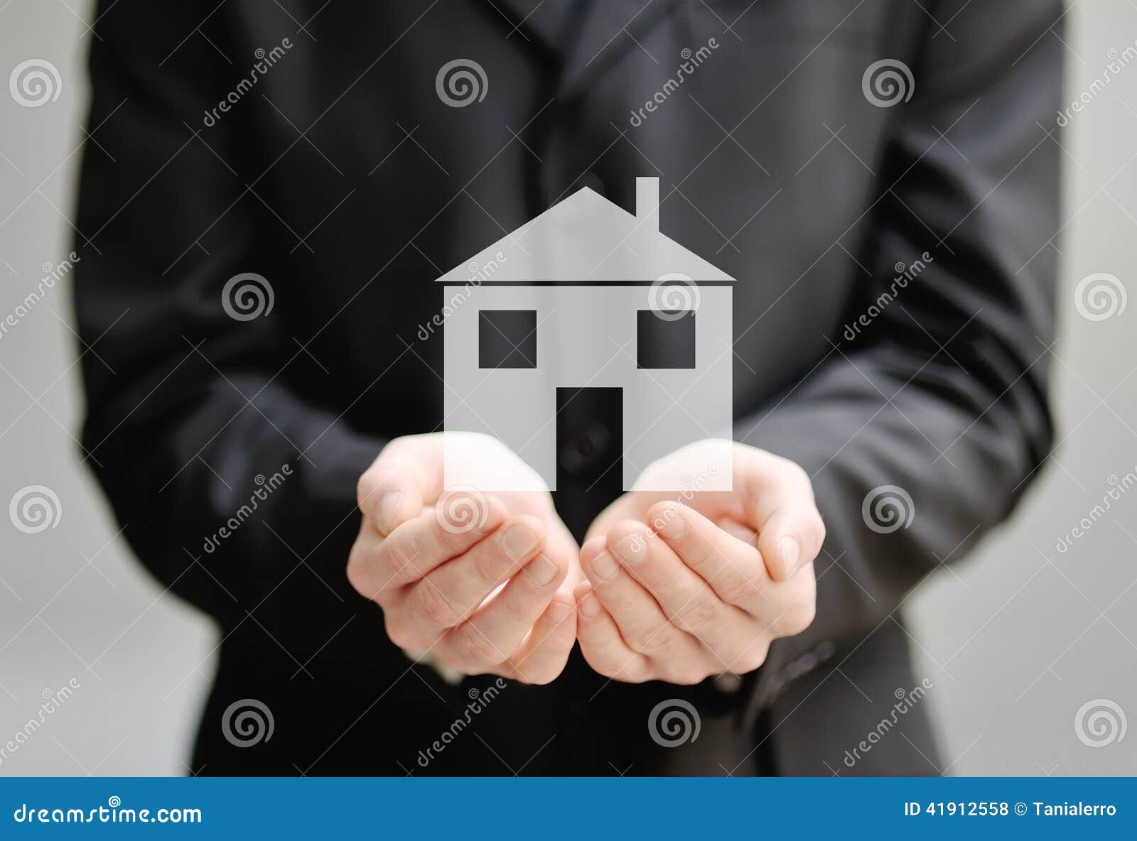 The Hands of a Man Holding a House - Insurance and Protection Concept ...