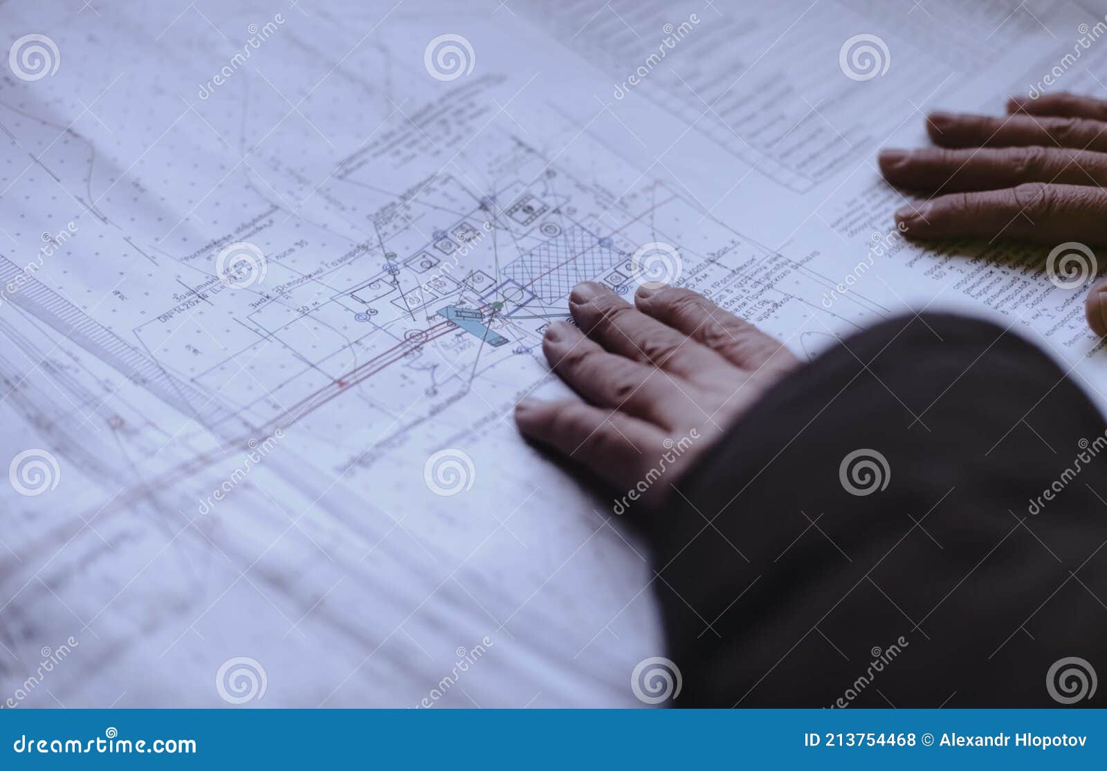 Hands of a Man on a Map Chart. Study of the Scheme of Pipelines Stock ...
