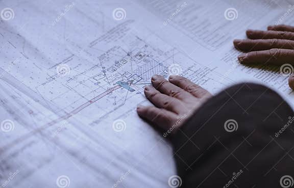 Hands of a Man on a Map Chart. Study of the Scheme of Pipelines Stock ...