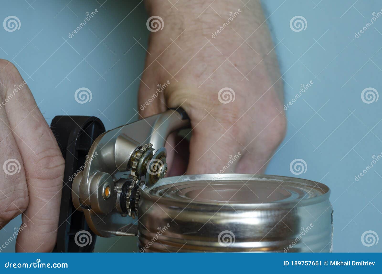 Hands of a Man Opens a Tin Can with a Can Key Stock Image - Image of ...