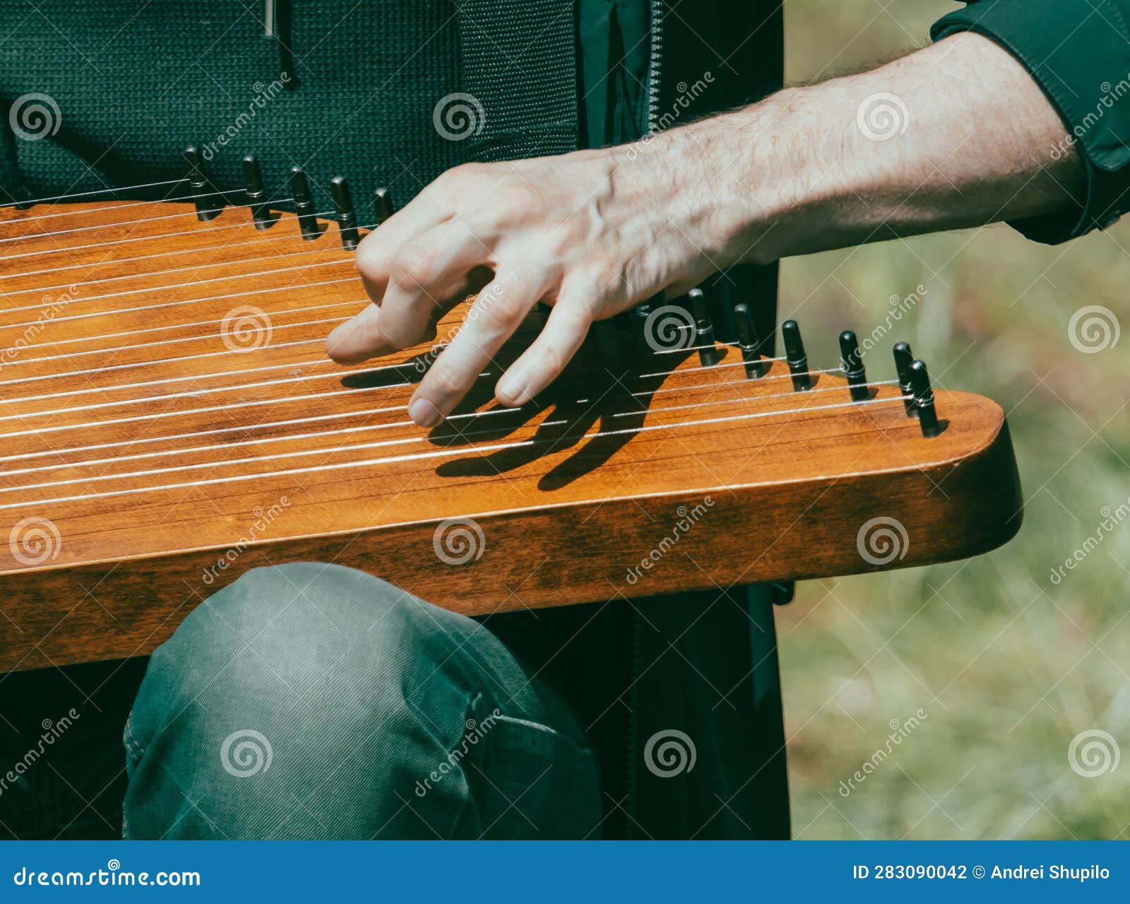 The Hands of a Man Playing the Harp on the Strings Stock Photo - Image ...