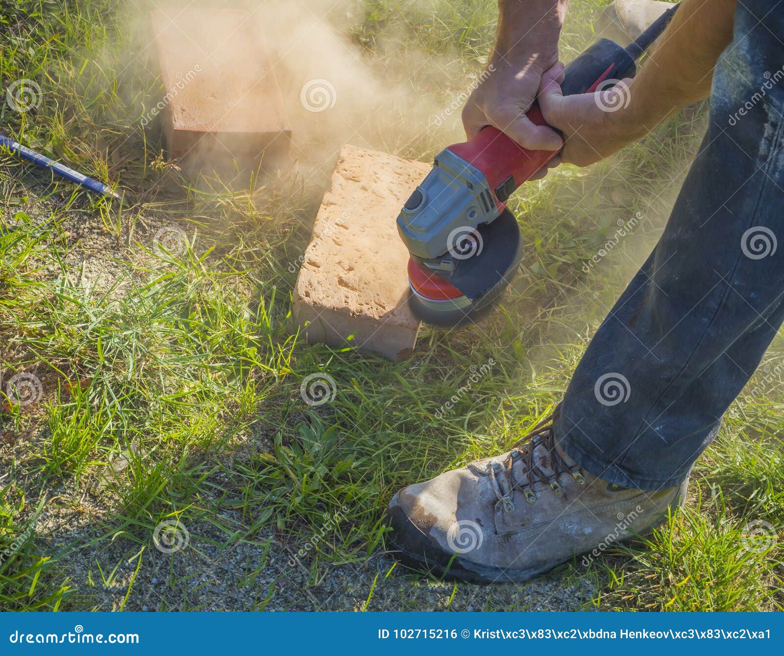 Hands of Man Polishing Brick Working with Portable Grinder Machine on ...