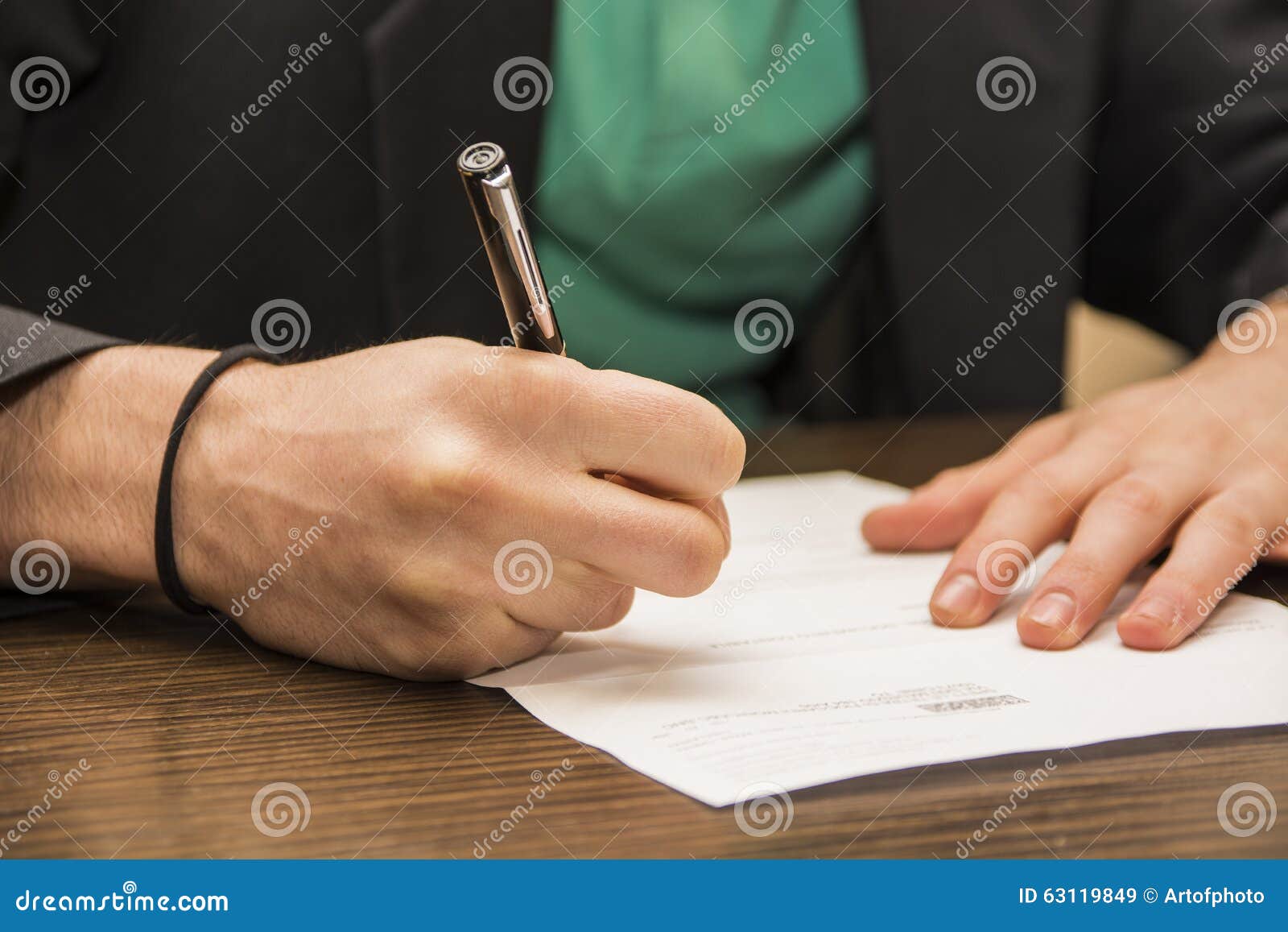 Hands of Man Signing a Sheet of Paper or Document Stock Image - Image ...