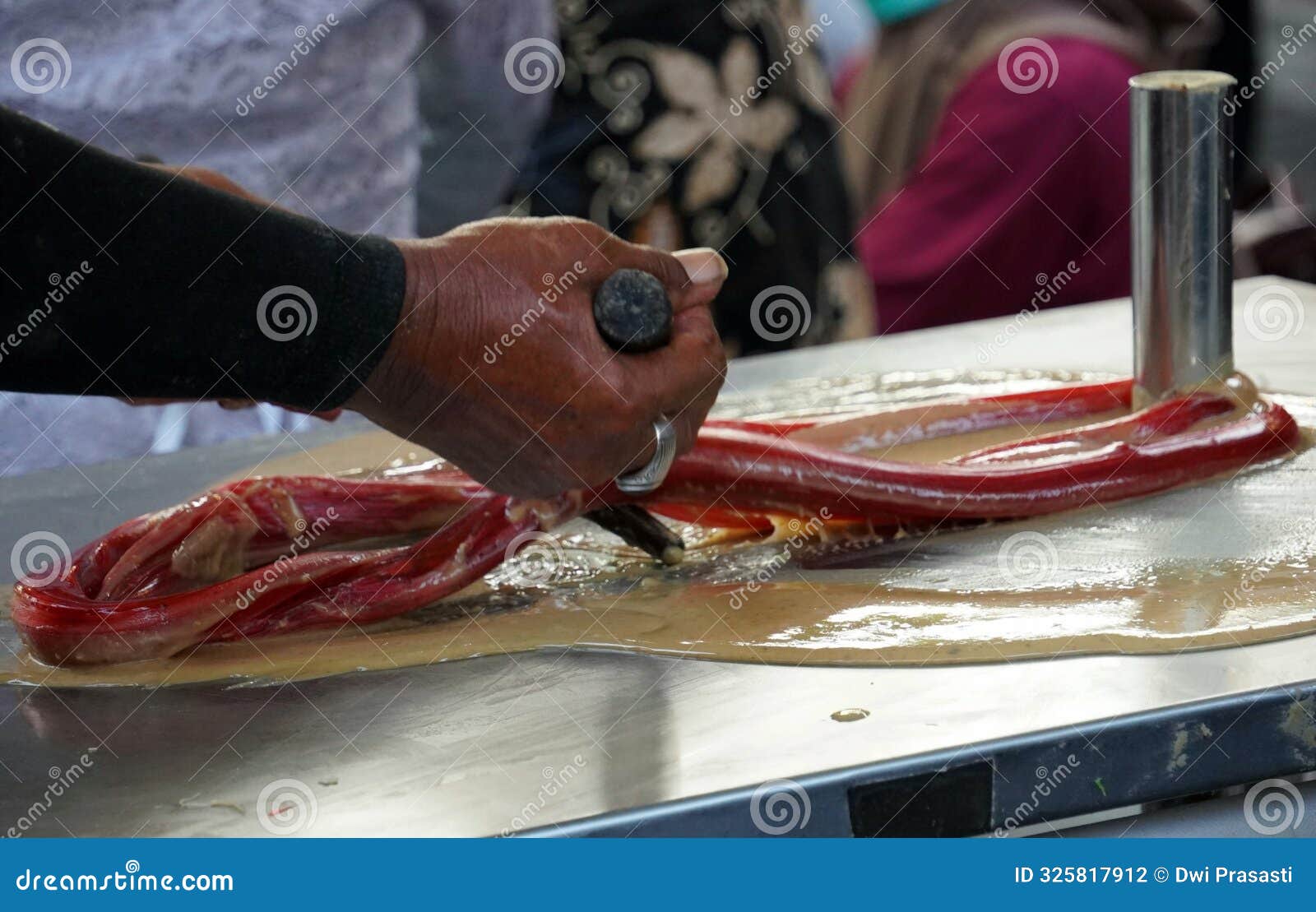 Hands Manually Pulling Candy Dough Repeatedly To Make Sweets. Stock ...