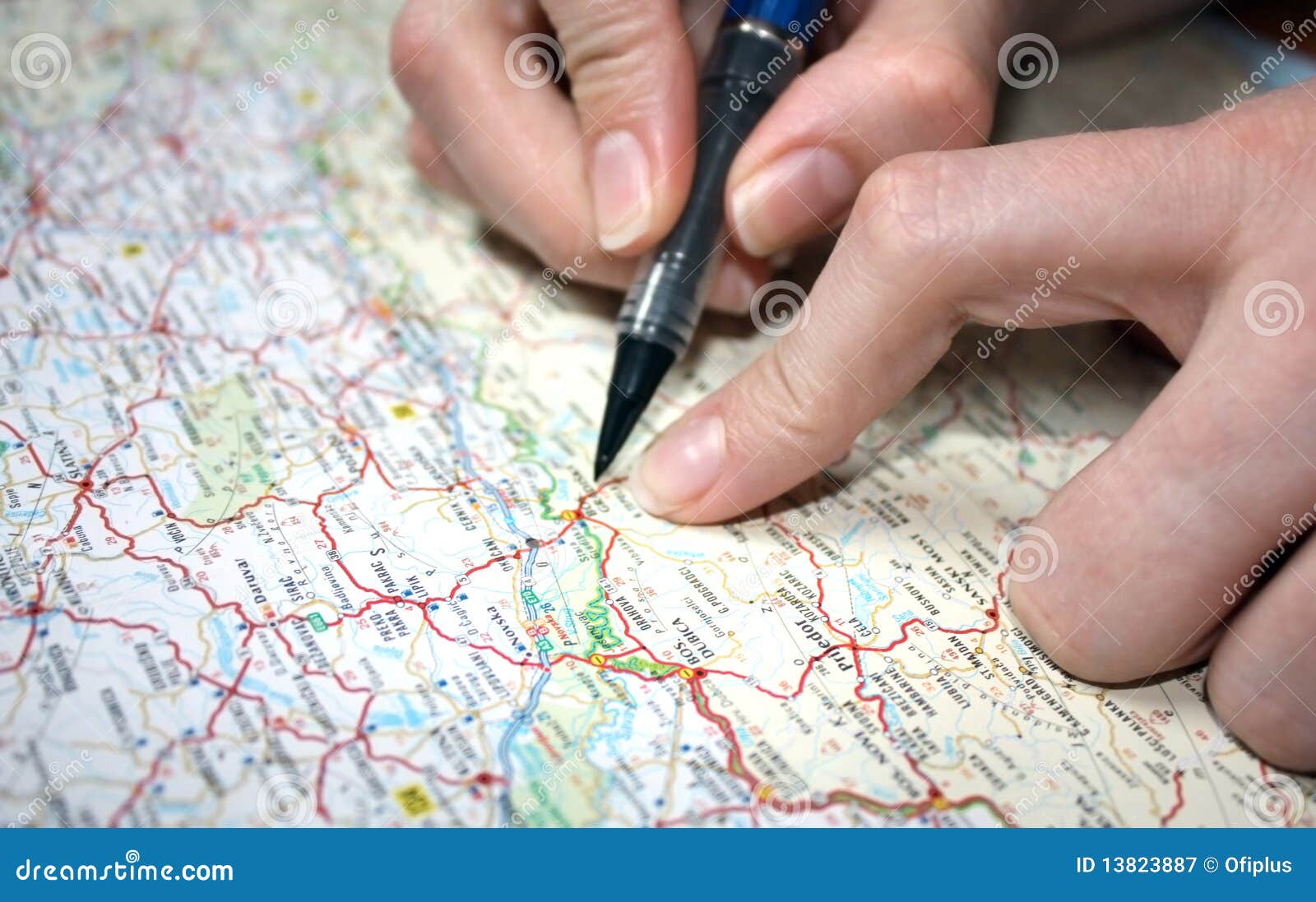 Hands On A Map Stock Image | CartoonDealer.com #13823887