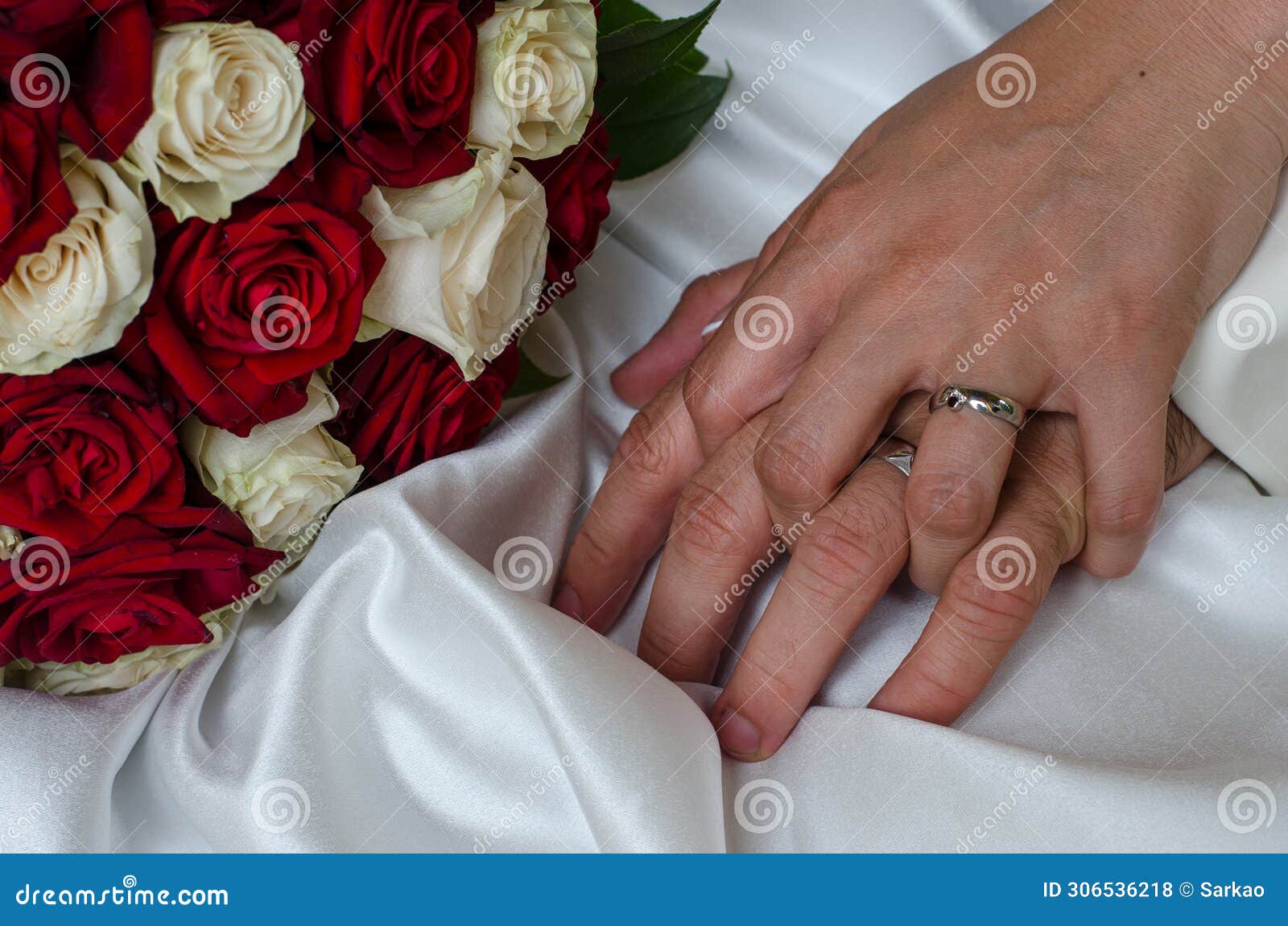 Hands of Married Couple with Rings and Roses Stock Photo - Image of ...