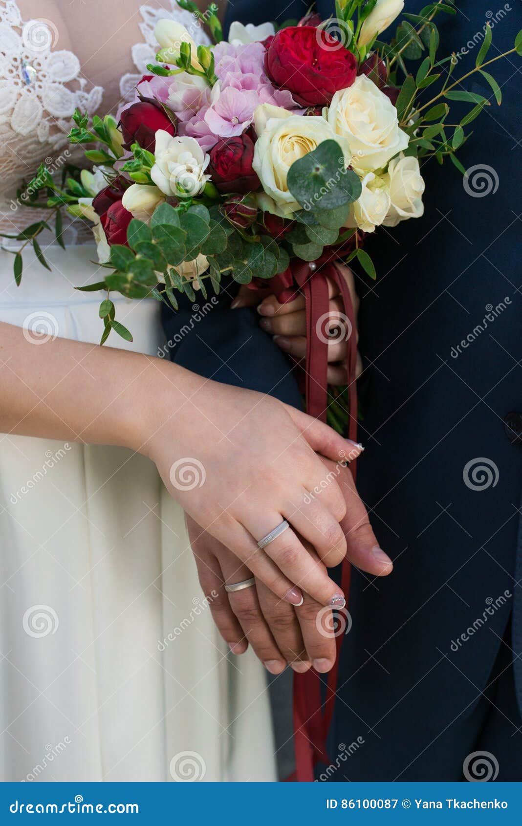 Hands of Married Couple with Rings and Wedding Bouquet. Stock Image ...