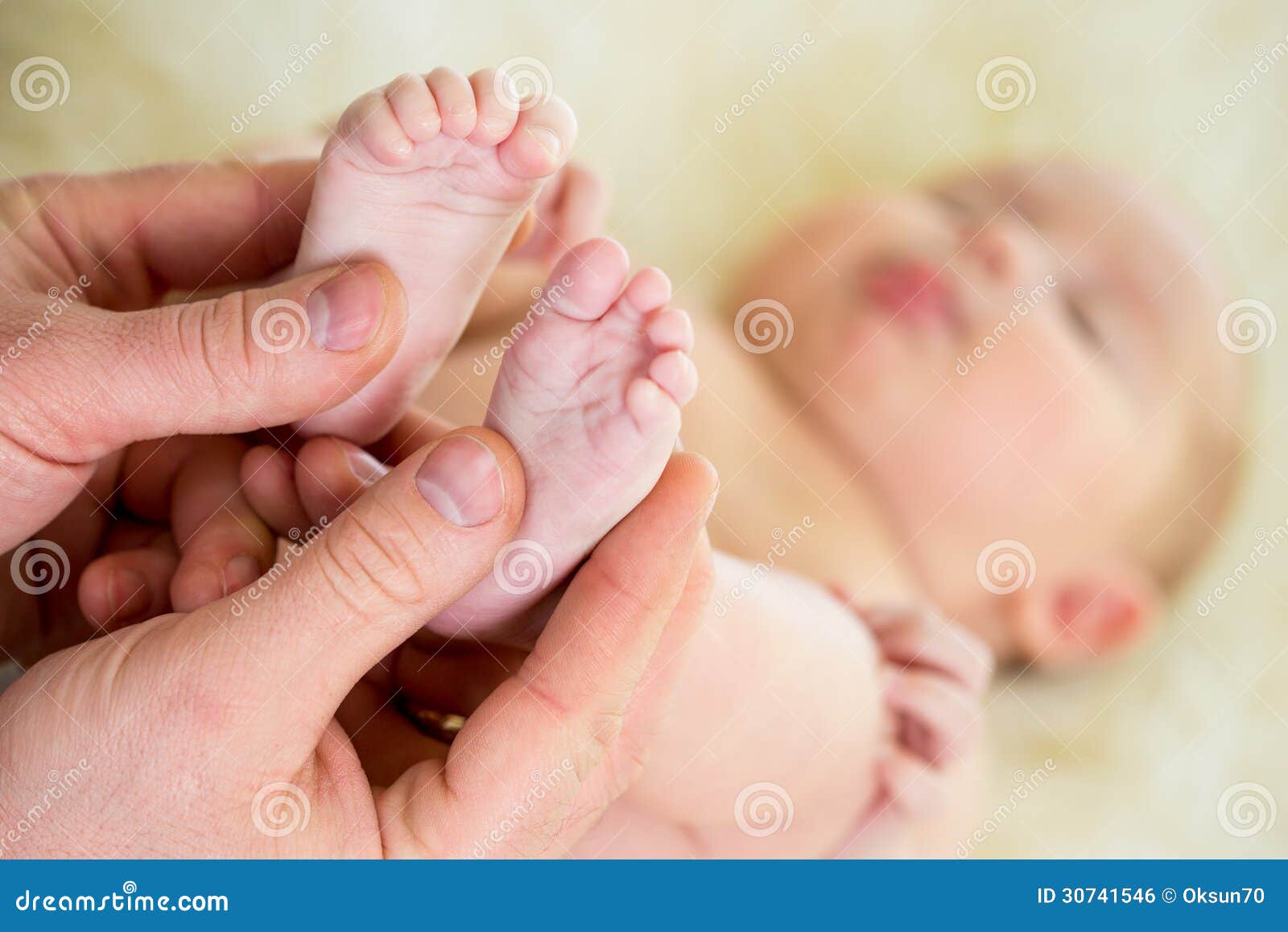 Hands Massaging Small Baby Feet Stock Photo | CartoonDealer.com #30741546