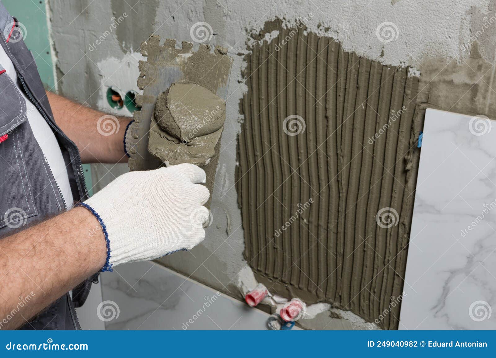The Adhesive Solution Is Applied To The Wall. Putty On The Wall, For ...