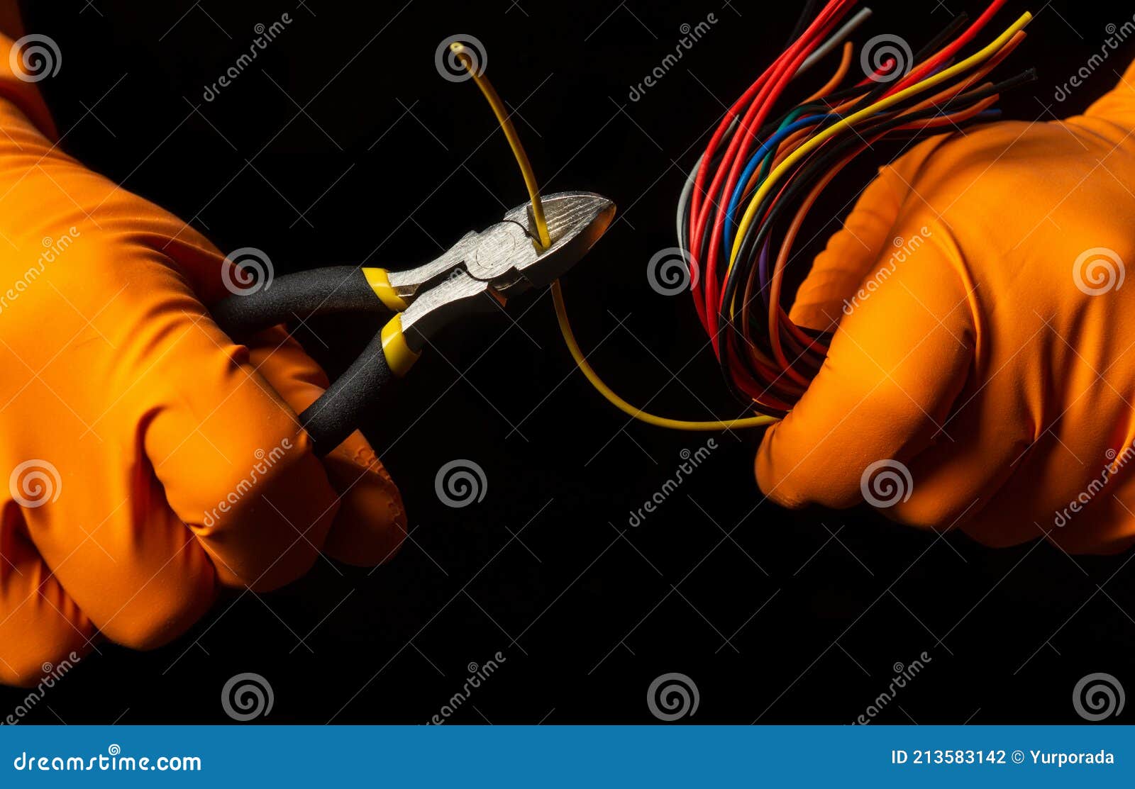 Hands of the Master in Gloves Hold Wire Cutters and Wire Closeup on ...