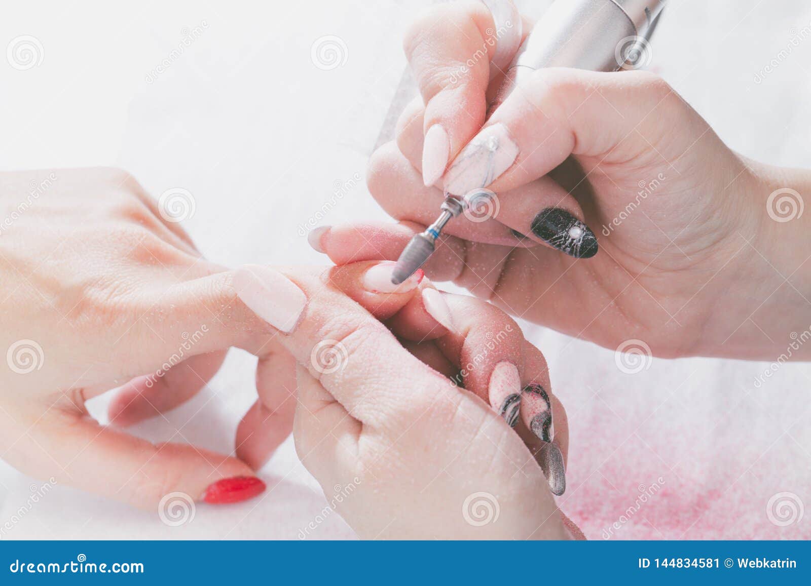 The Hands of the Master of Manicure and the Hands of the Client Close ...