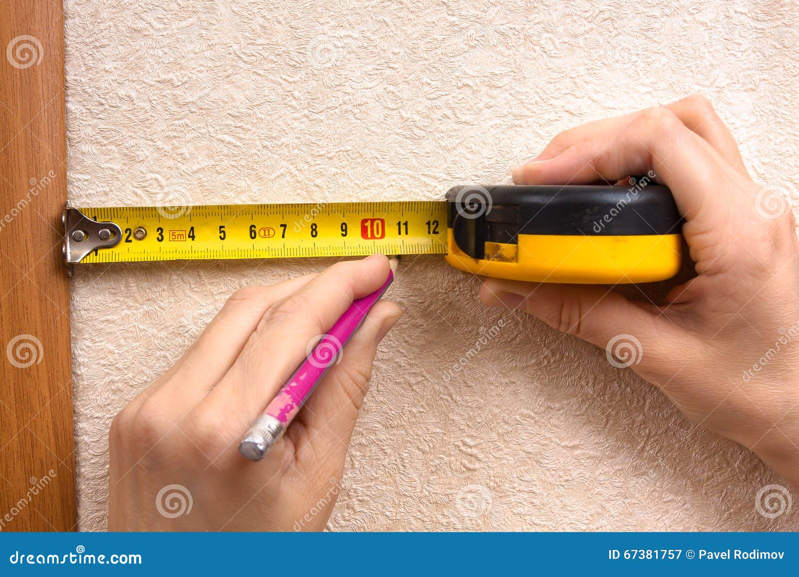 Hands Measuring Wall with Tape Measure Stock Image - Image of room ...