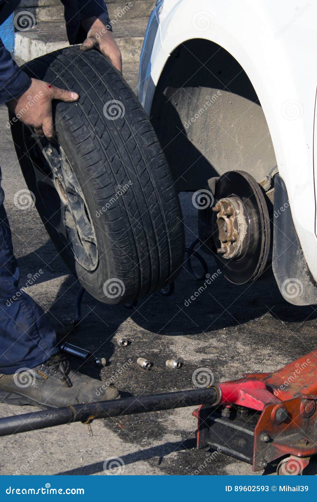 Hands of Mechanic Changing Car Wheel in Auto Repair Service Stock Image ...