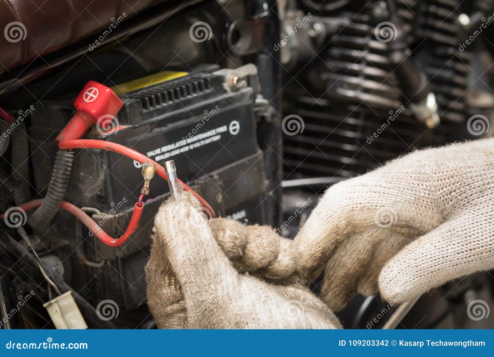 The Hands of the Mechanic Replacing Fuse in Motorcycle and Sele Stock ...