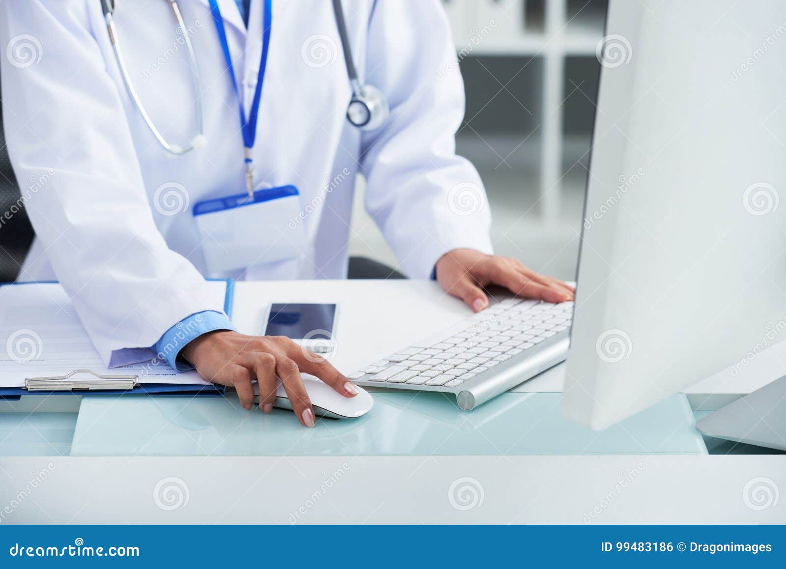 Doctor working on computer stock photo. Image of closeup - 99483186