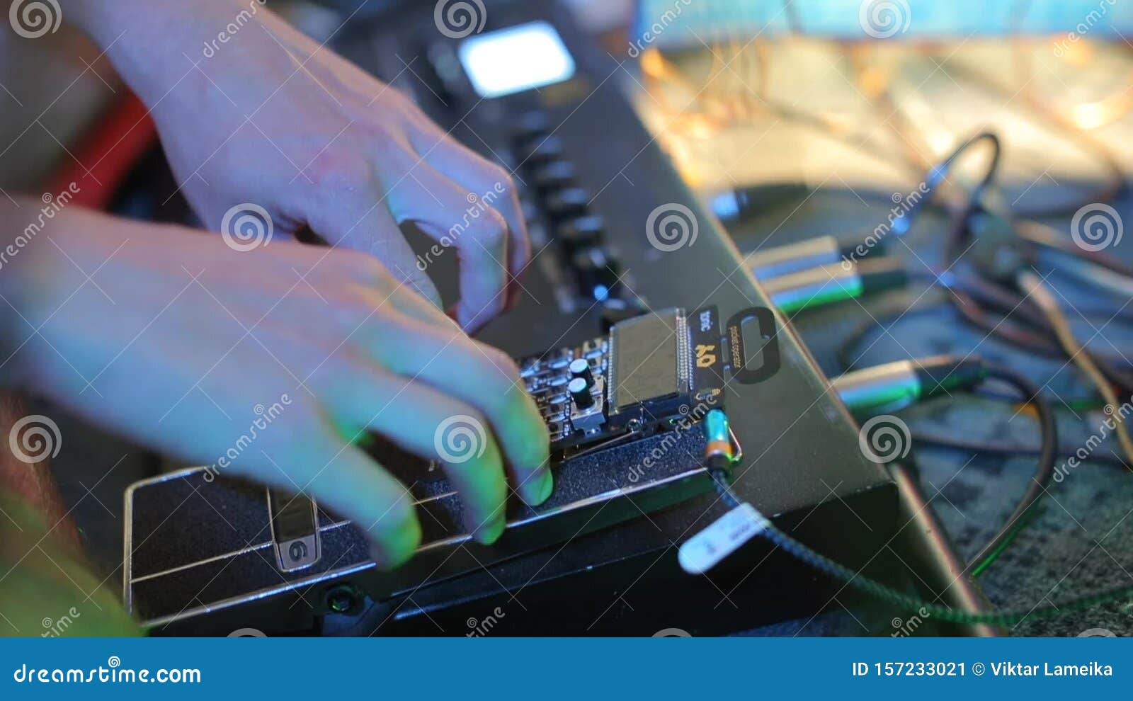 Hands of a Musician, DJ Working with a Pocket Operator, Mixer Stock ...