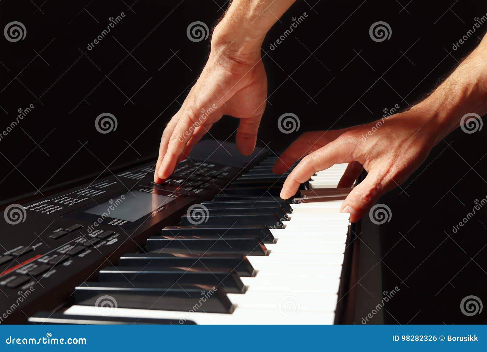 Hands of Musician Play the Keys of the Synthesizer on Black Background ...