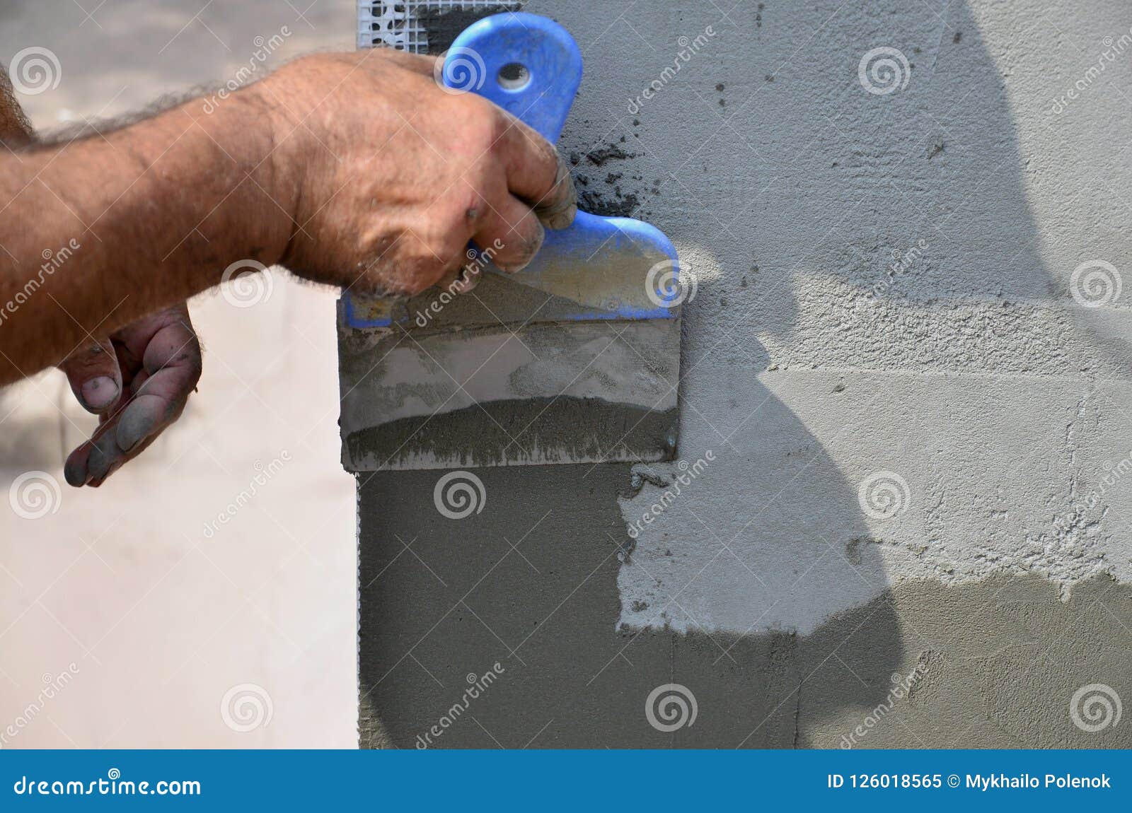 Hands of an Old Manual Worker with Wall Plastering Tools Renovating ...
