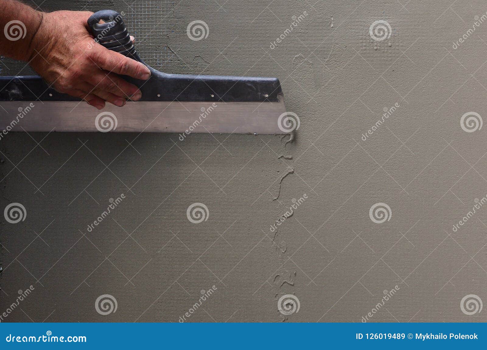 Hands of an Old Manual Worker with Wall Plastering Tools Renovating ...