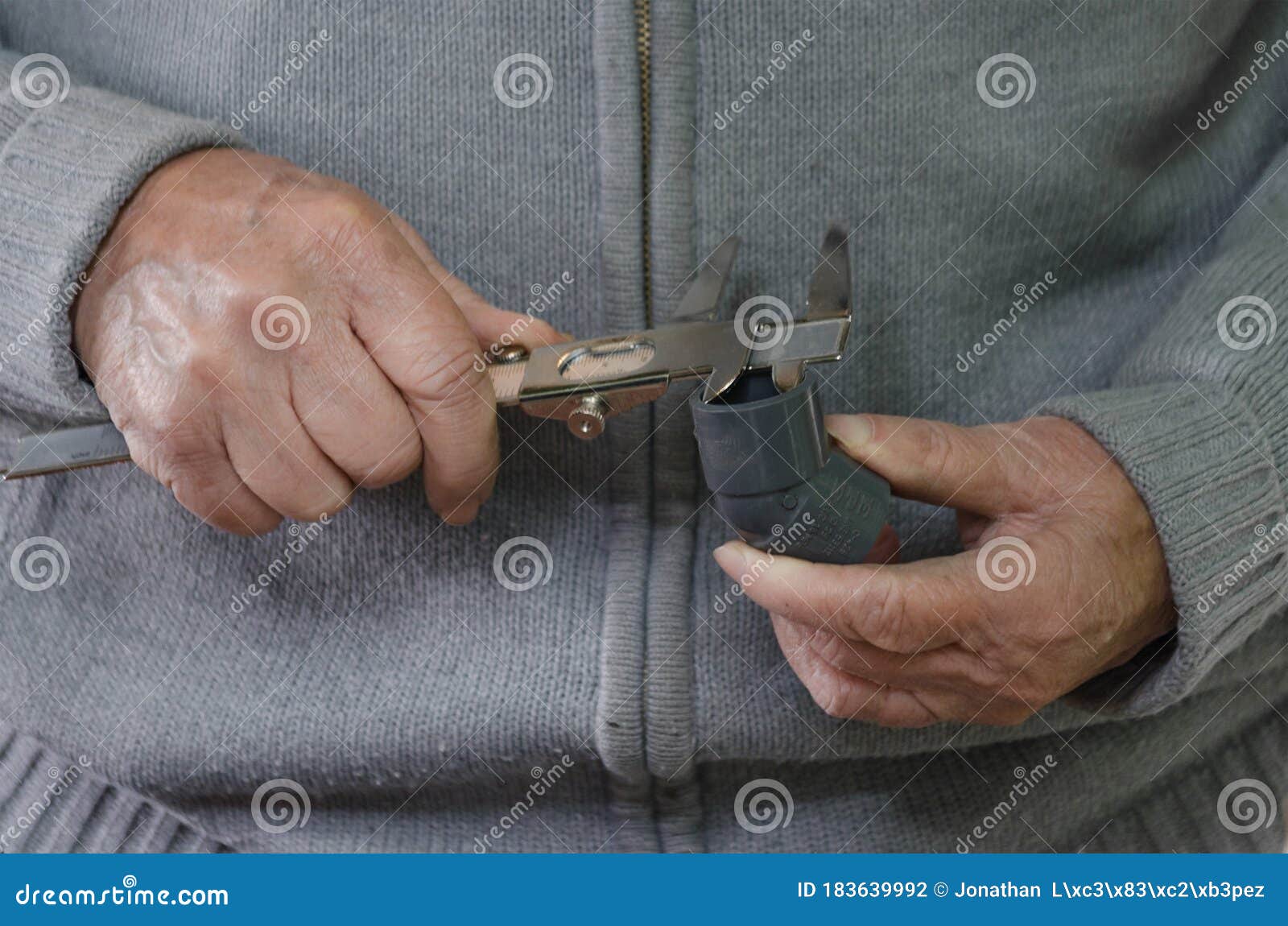 Hands of a Person Holding a Caliper Stock Photo - Image of caliper ...