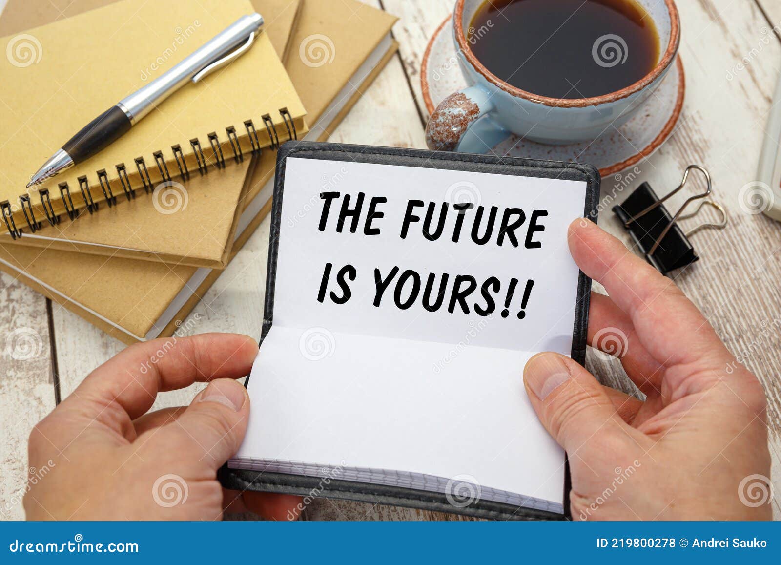 Hands Open a Notebook with the Inscription the Future is Yours Stock ...