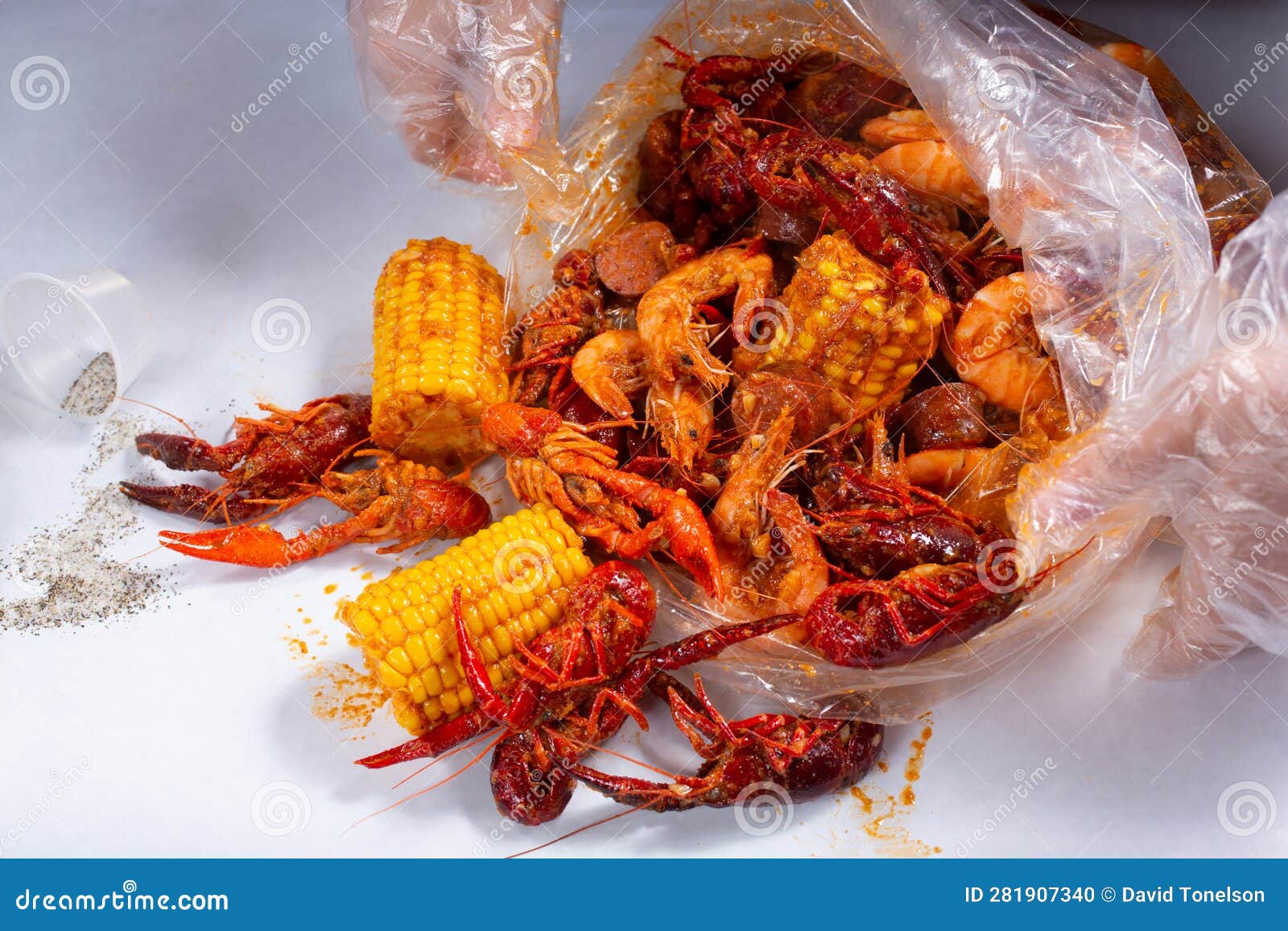 Hands Open Plastic Bag Full of Seafood Boil Stock Photo - Image of ...